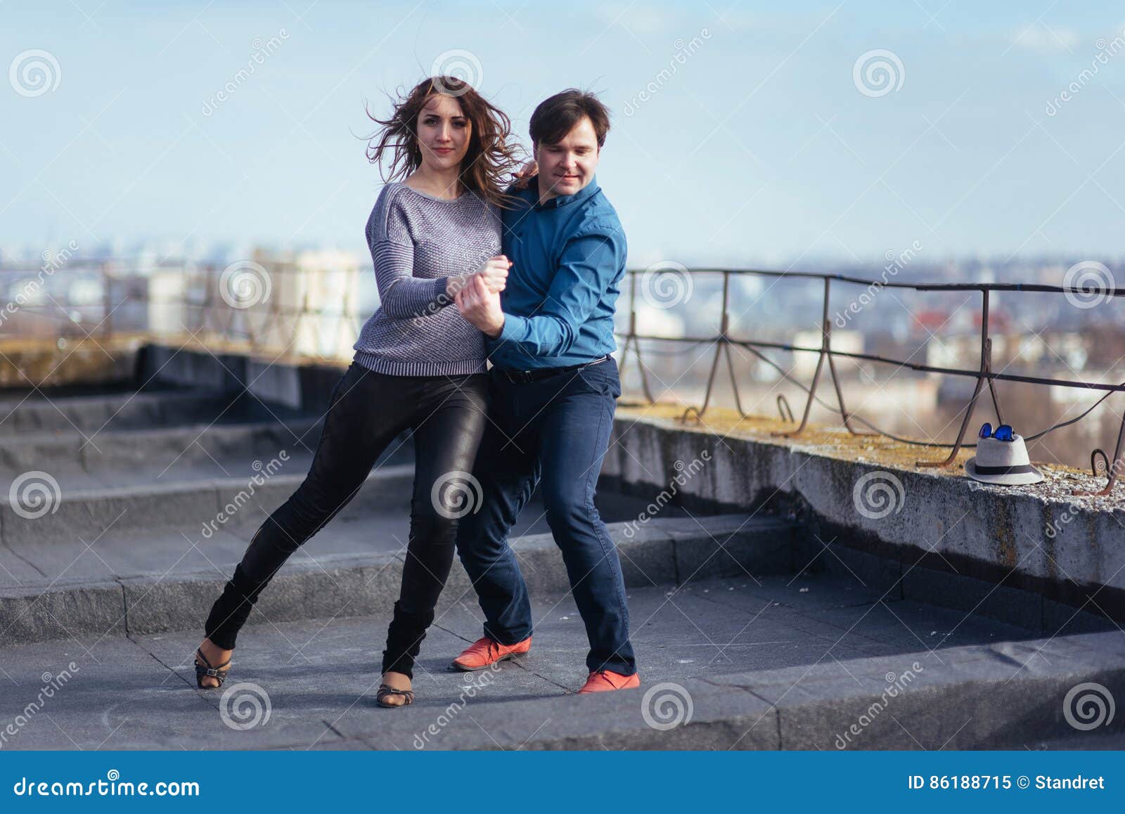 Young Couple Dancing on the Roof of a Tall Building Stock Image - Image ...