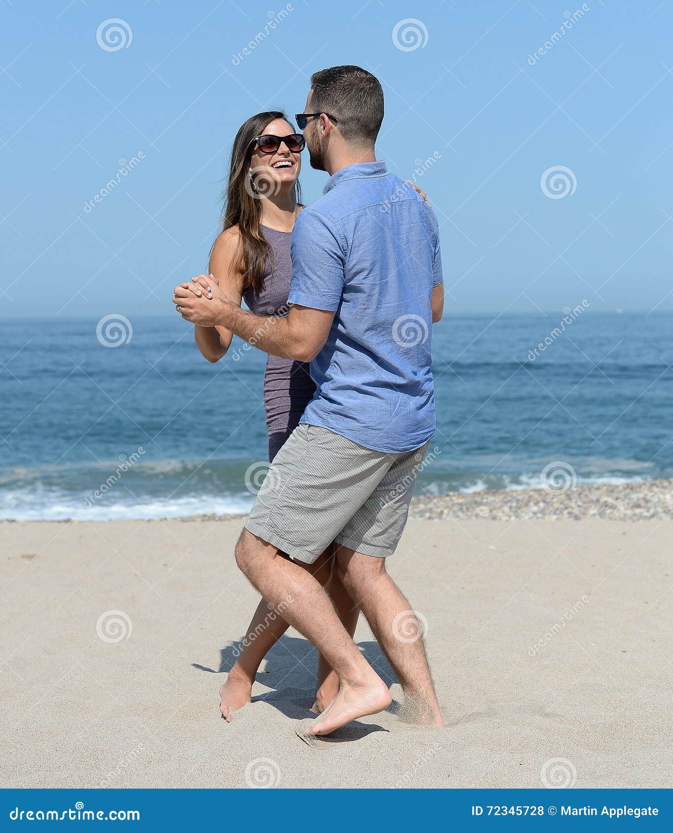 Young Couple Dancing on Sandy Beach Stock Photo - Image of sandy, smile ...