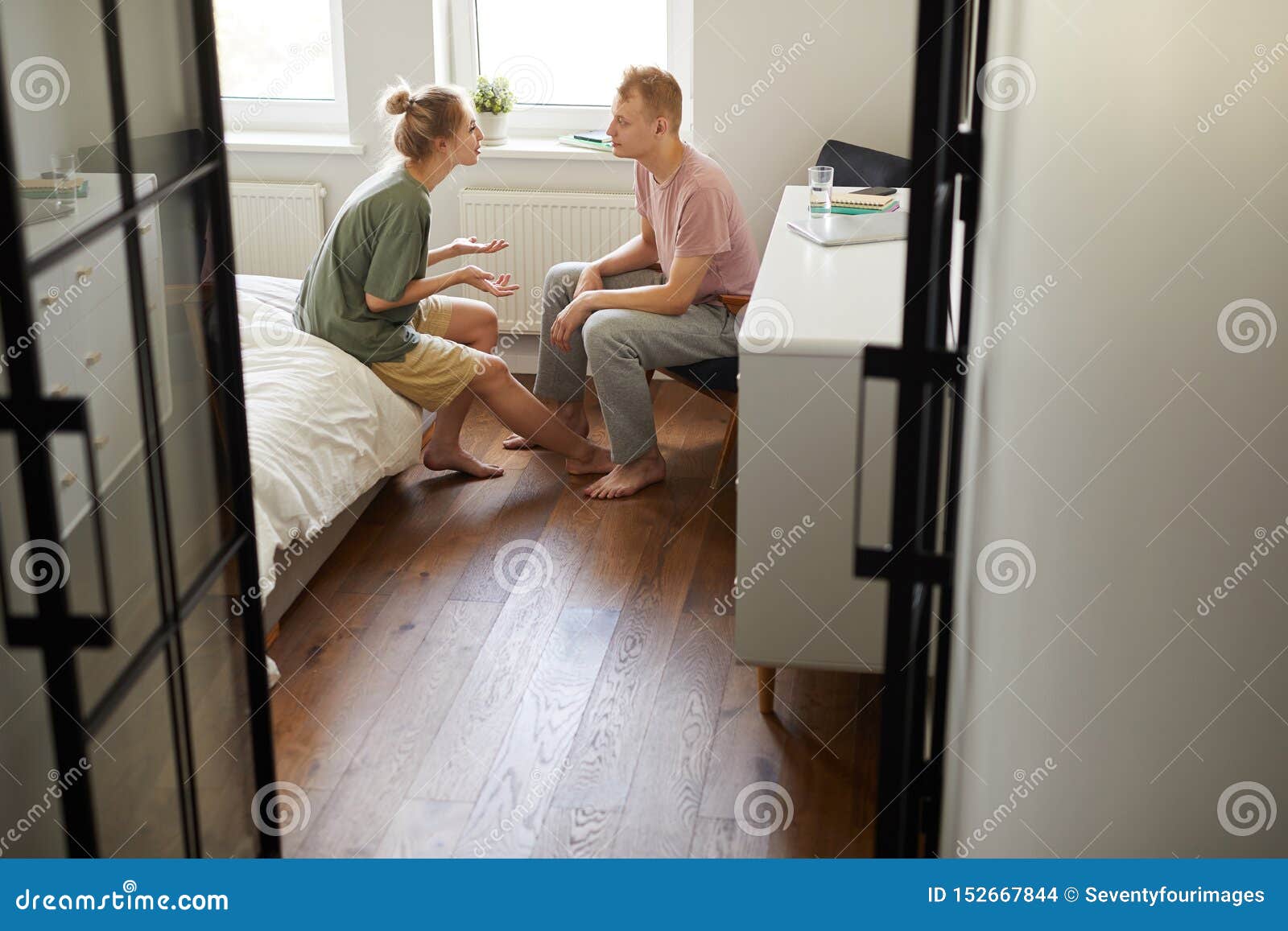 Young Couple Discussing Problem at Home Stock Photo - Image of date ... Young Couple Discussing Problem at Home Stock Photo - Image of date ...