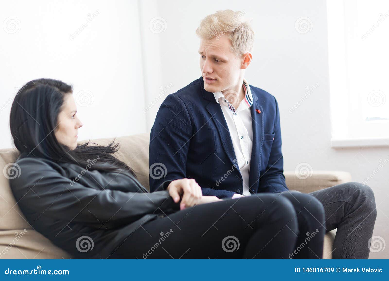 Young Couple Disputing Problem while Sitting on Sofa Stock Image ...