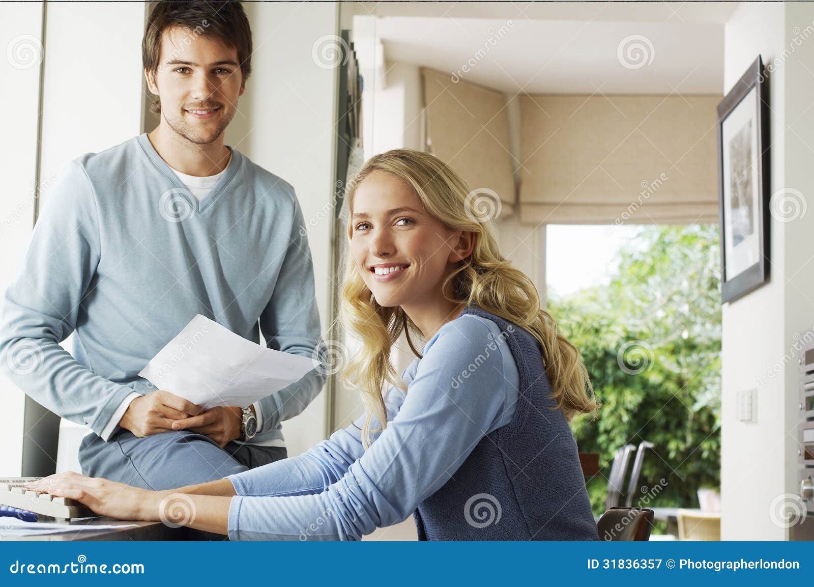 Young Couple with Documents and Computer Stock Image - Image of holding ...
