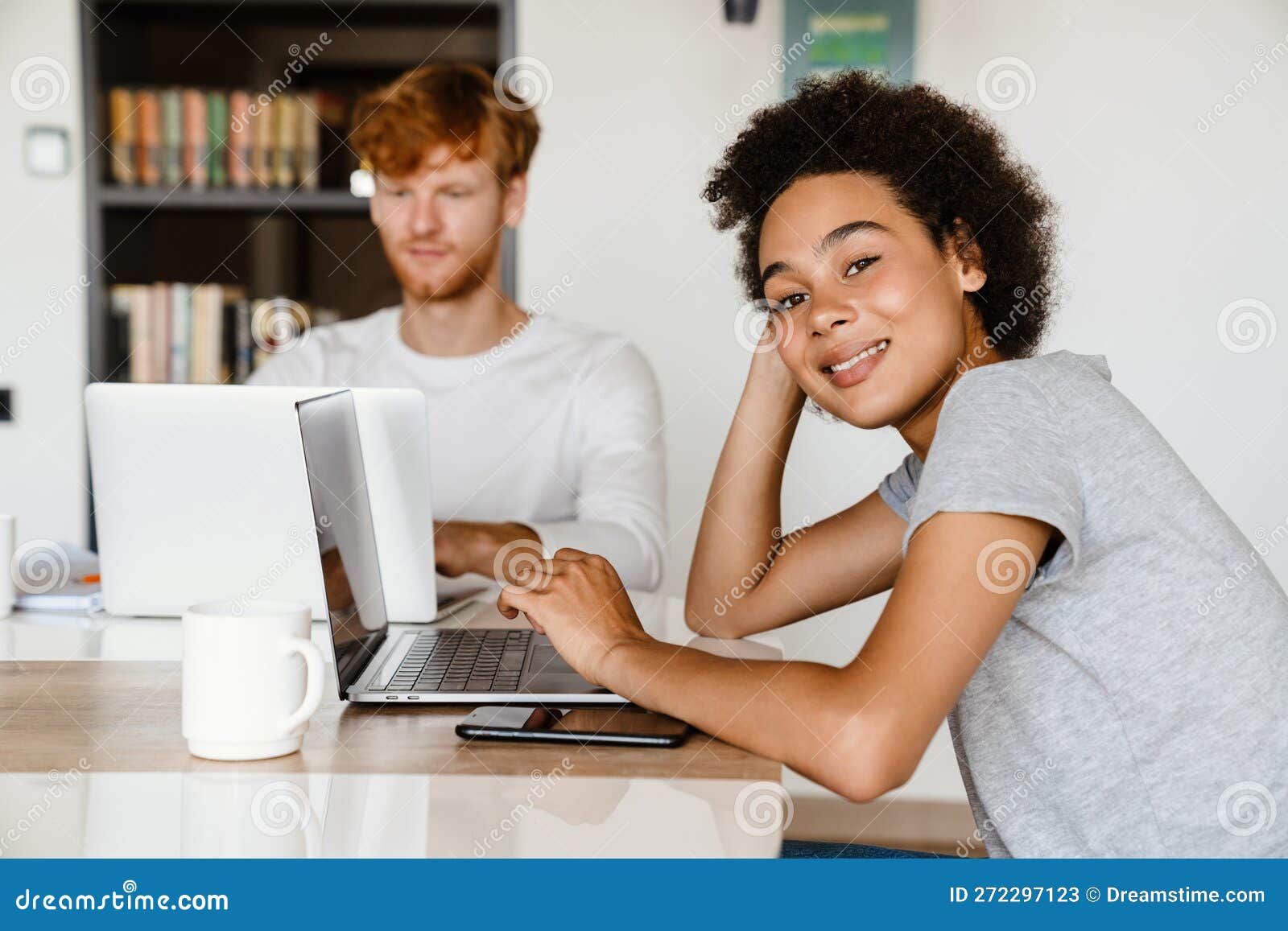 Young Couple Drinking Coffee while Using Laptops Together at Home Stock ...