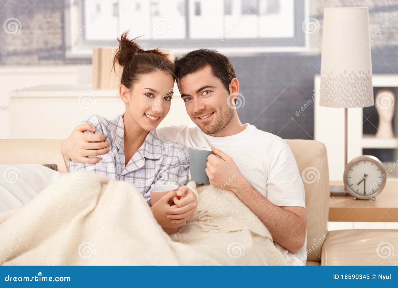 Young Couple Drinking Tea in Bed Smiling Happily Stock Image - Image of ...