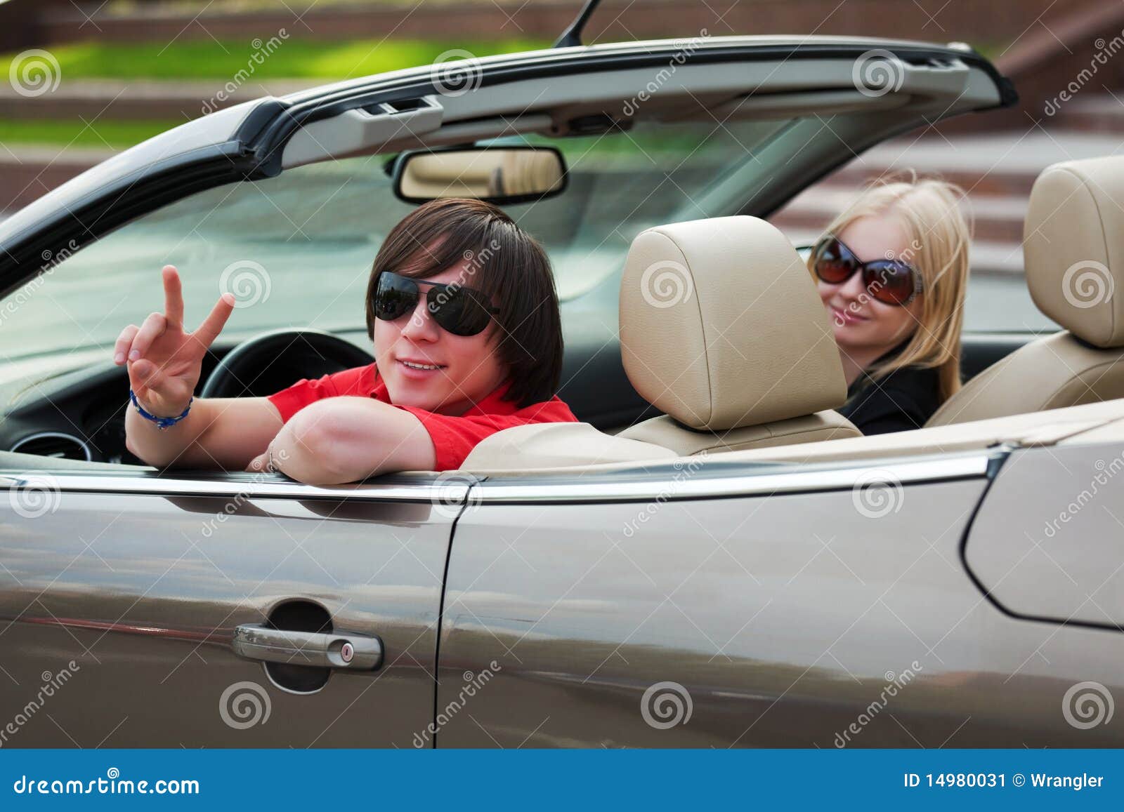Young couple driving a car stock image. Image of look - 14980031