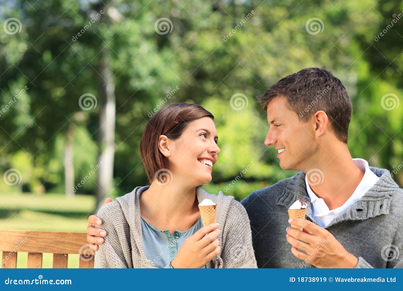 Young Couple Eating an Ice Cream Stock Image - Image of garden, summer ...