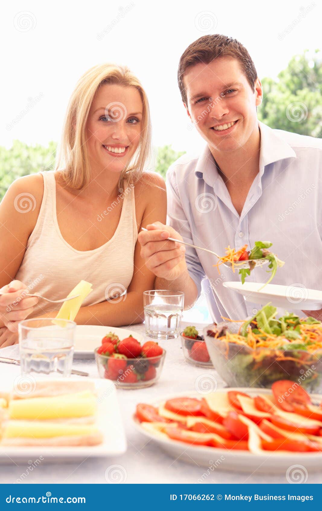 Young Couple Eating Outdoors Stock Photo - Image of summer, exterior ...