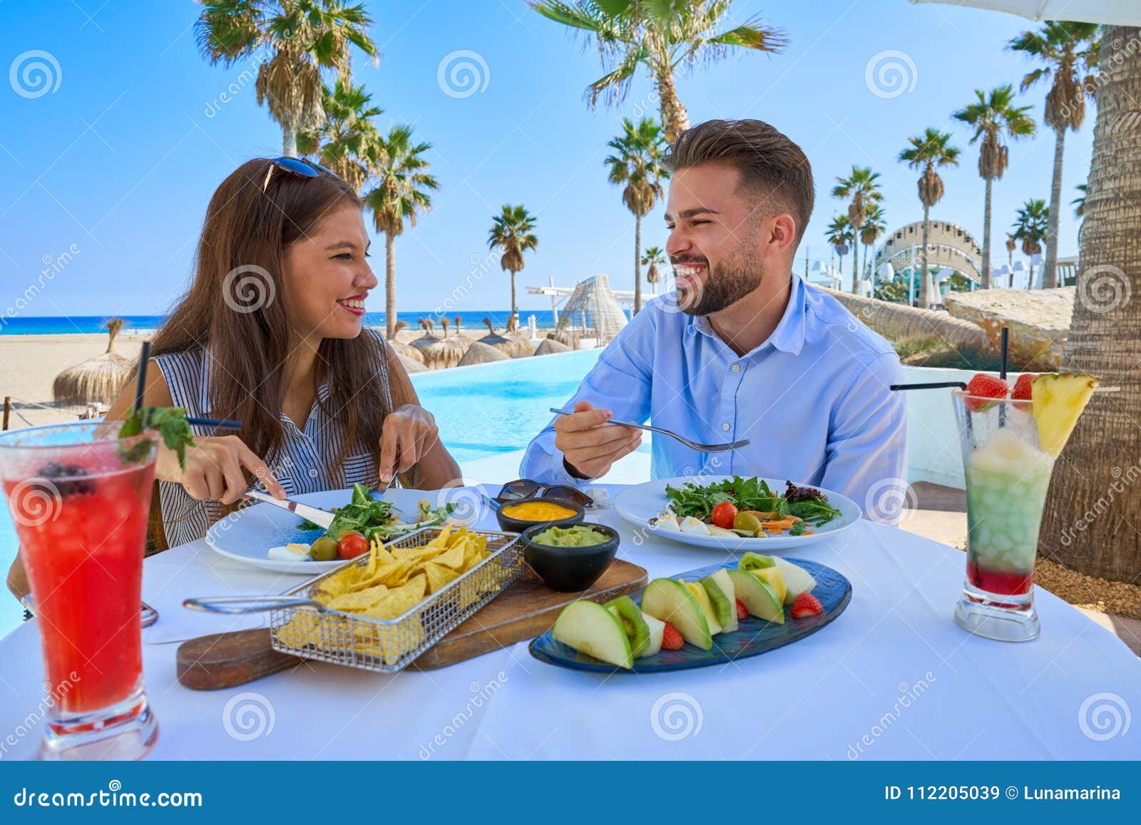 Young Couple Eating in a Pool Restaurant Stock Image - Image of resort ...