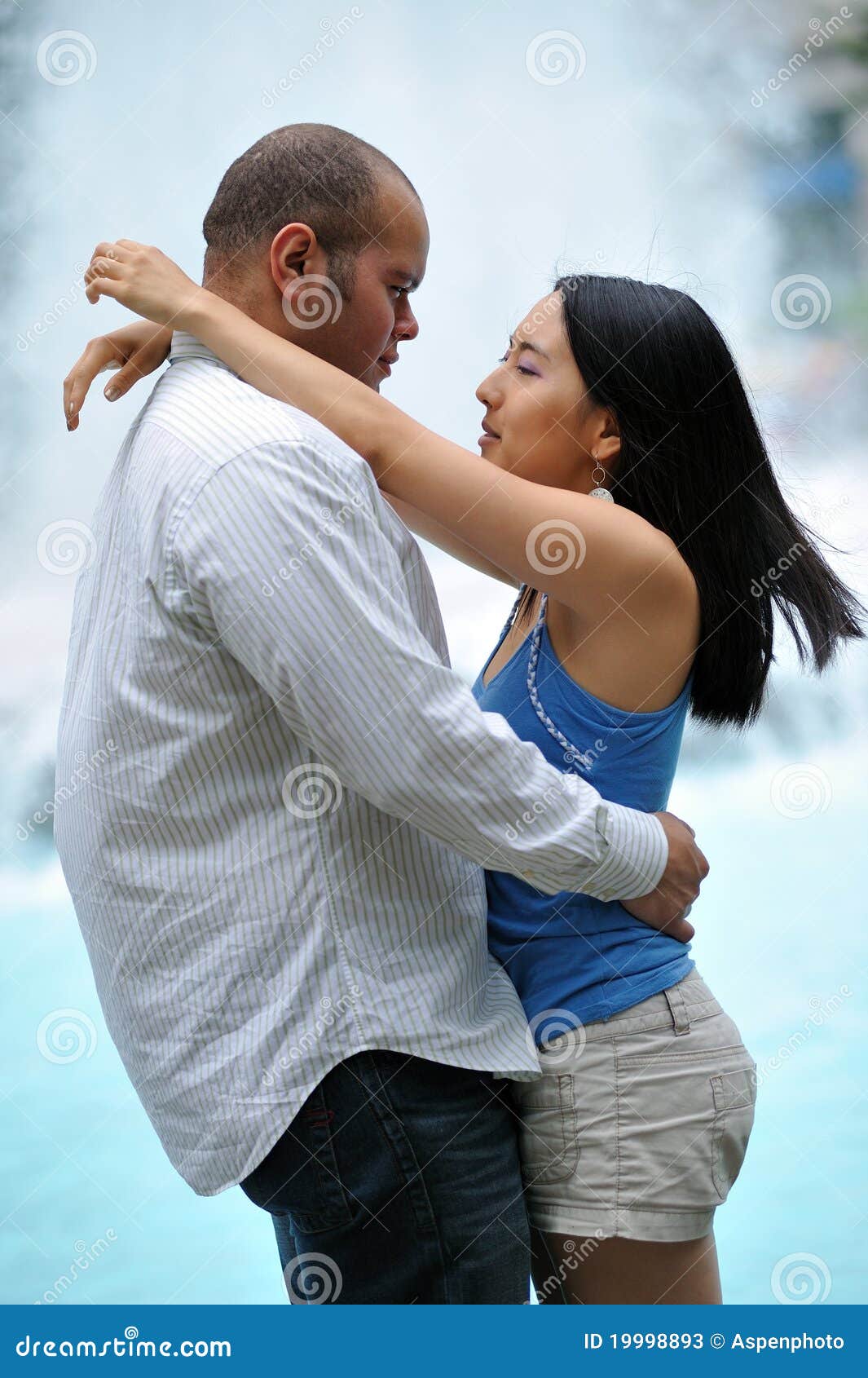 Young Couple Embrace in Front of Fountain Stock Image - Image of city ...