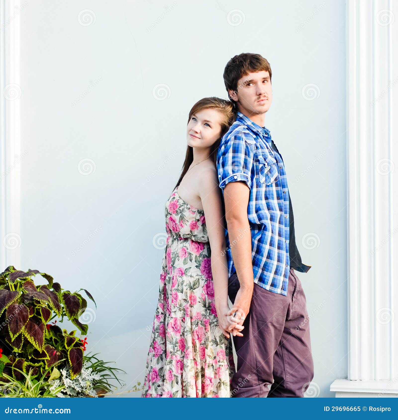 Young Couple Embracing Back To Back Stock Image - Image of family ...
