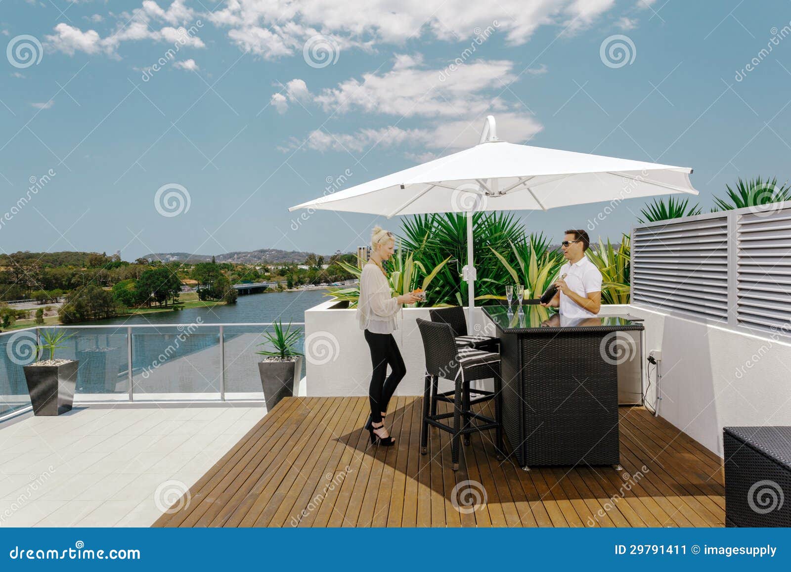 Couple on balcony stock image. Image of home, glass, estate - 29791411