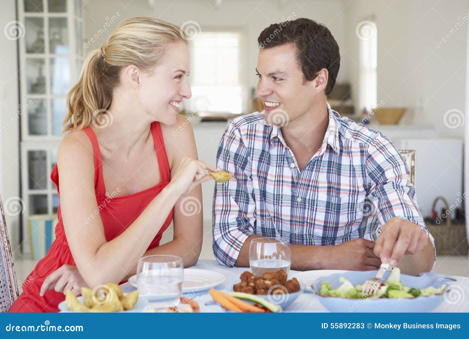 Young Couple Enjoying Meal Together Stock Image - Image of dining ...