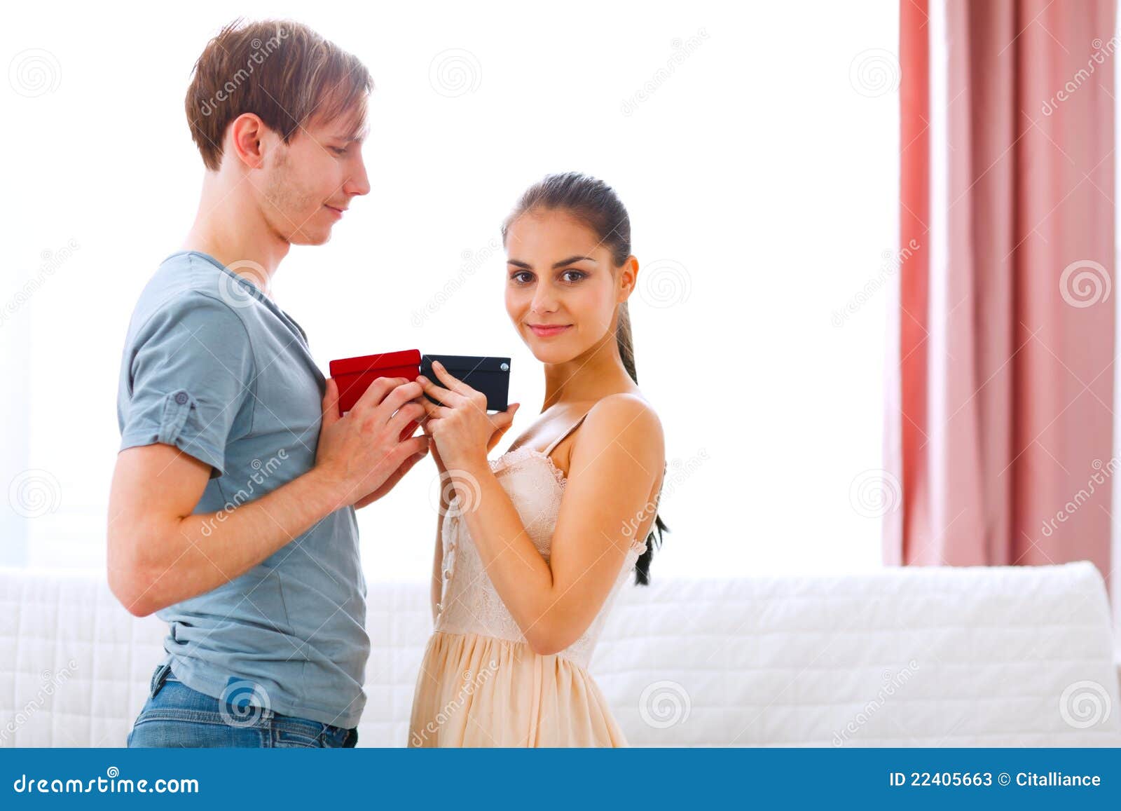 Young Couple Exchanging Gifts Stock Image - Image of happy, beautiful ...
