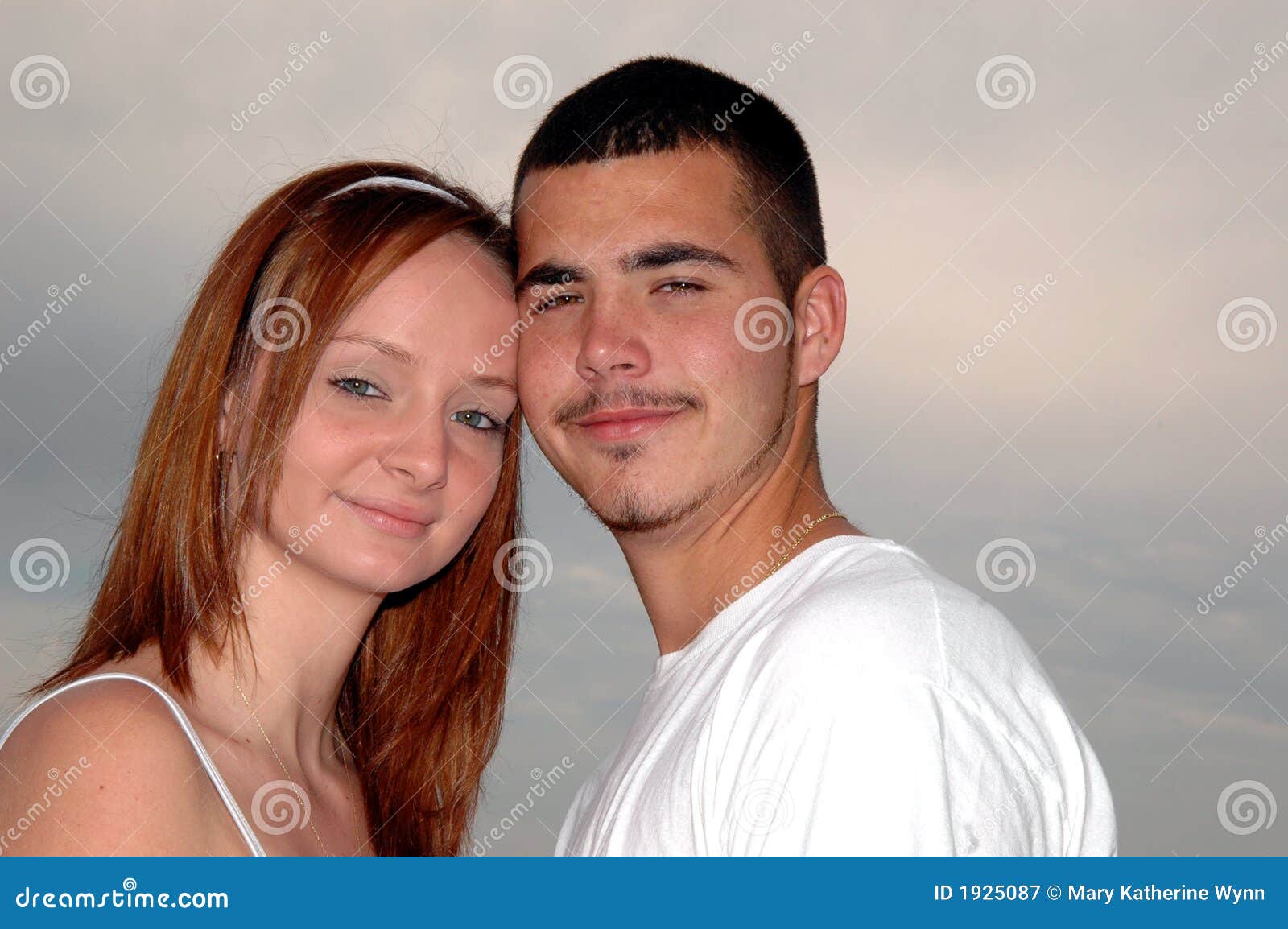 Young couple faces stock image. Image of girl, affectionate - 1925087