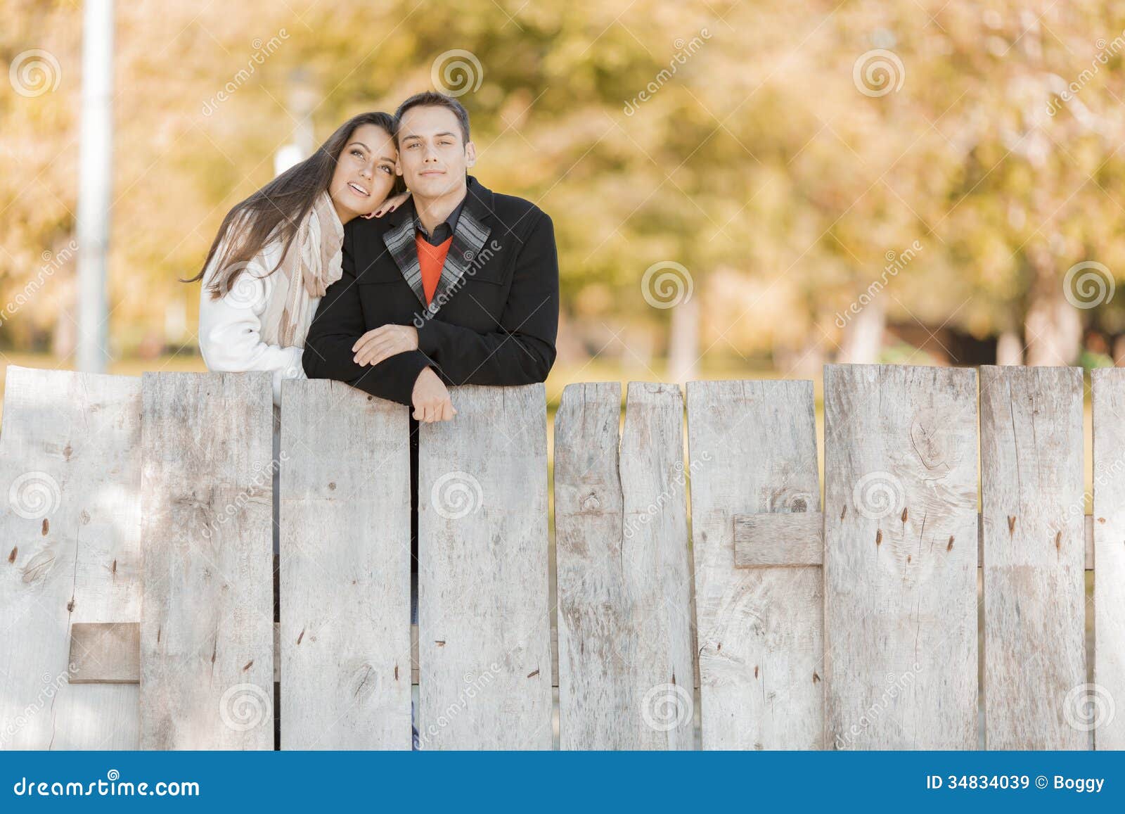 Young couple by the fence stock image. Image of happy - 34834039