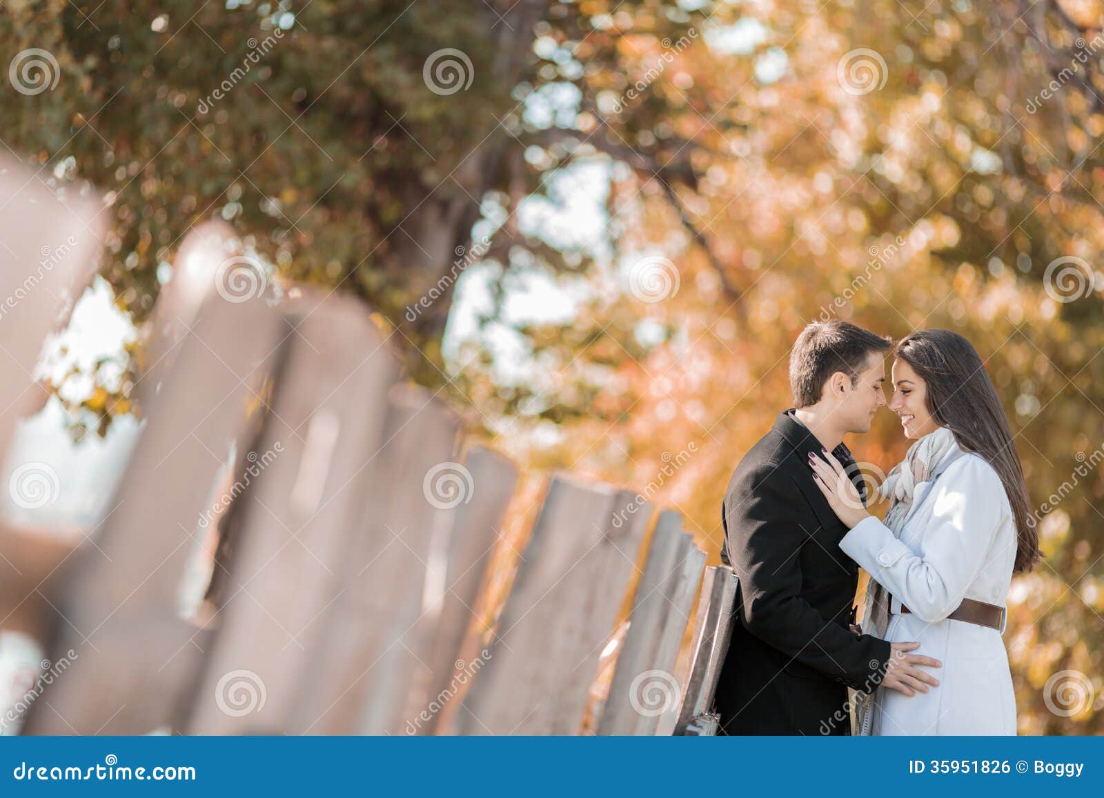 Young couple by the fence stock photo. Image of lifestyle - 35951826
