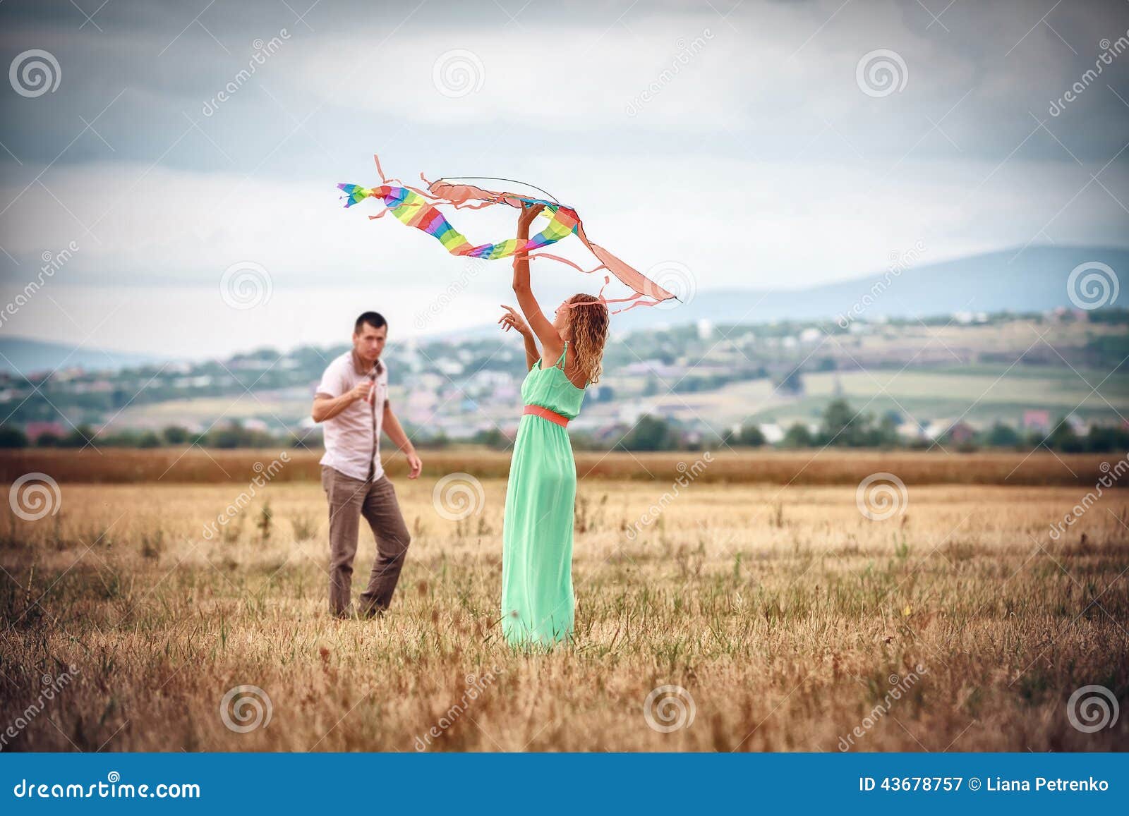 Young couple flying a kite stock image. Image of love - 43678757