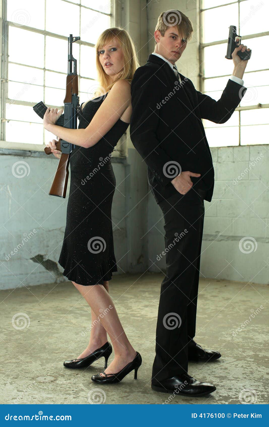 Young couple with guns. stock photo. Image of formal, couple - 4176100