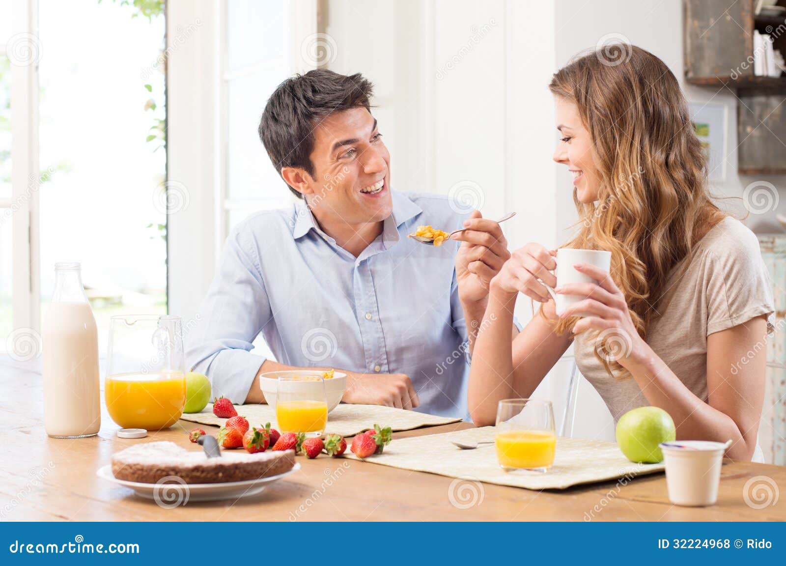 Young Couple Having Breakfast Stock Photo - Image of affectionate ...