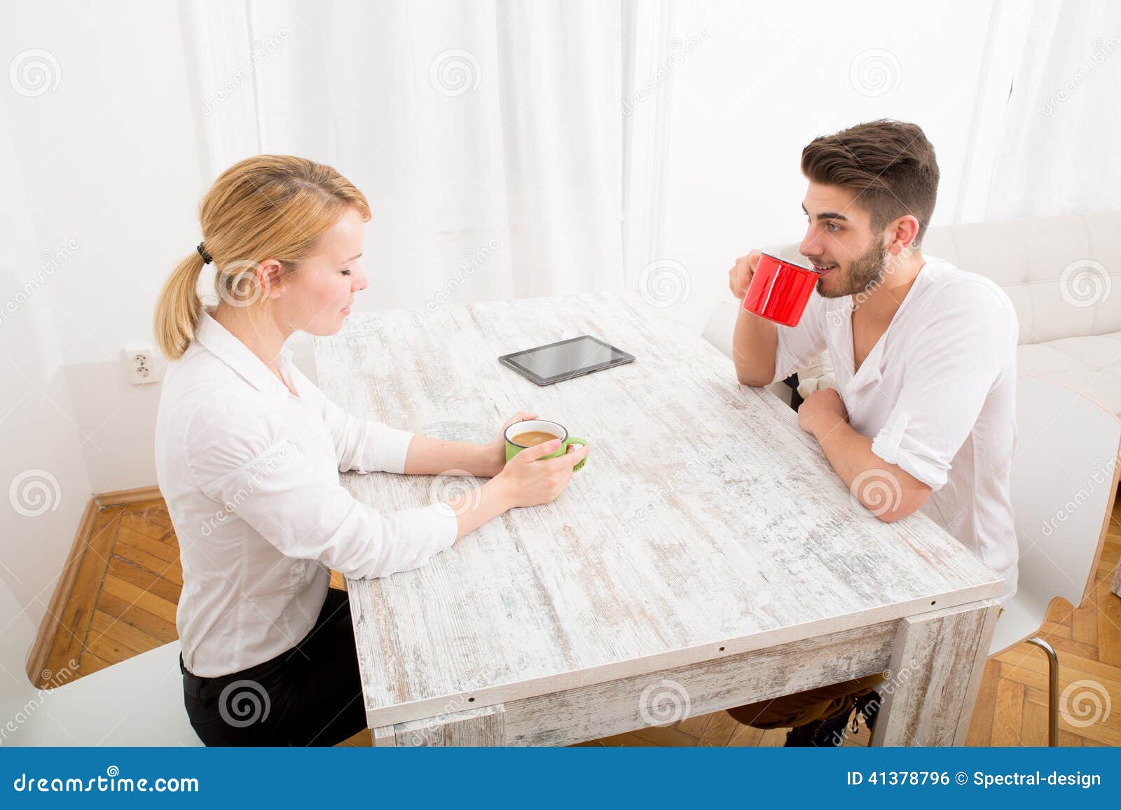 Young Couple Having a Coffee Break Stock Photo - Image of indoors ...