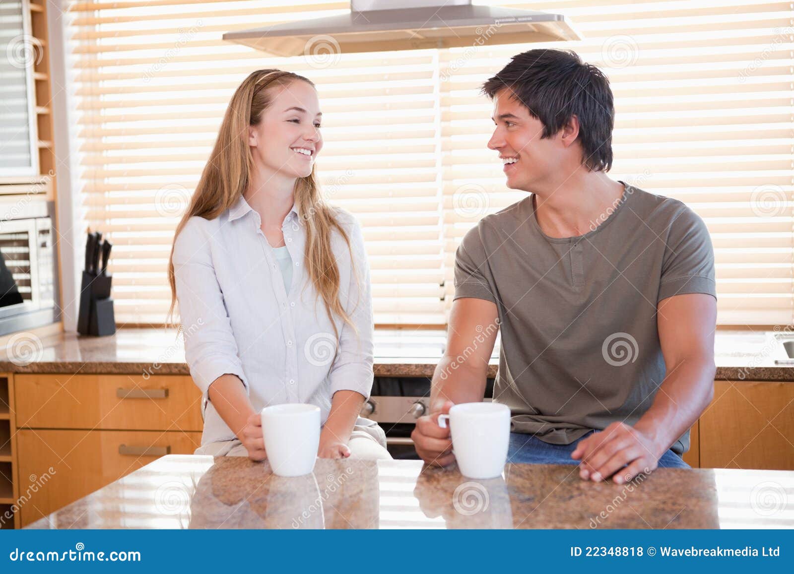 Young Couple Having a Cup of Coffee Stock Photo - Image of casual, face ...
