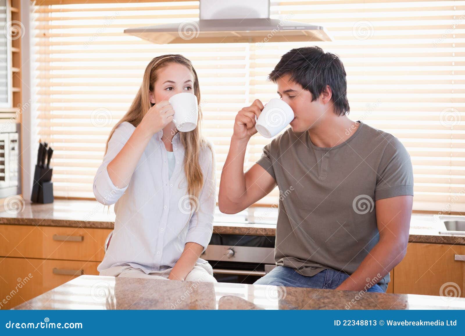 Young Couple Having a Cup of Tea Stock Image - Image of coffee, pretty ...