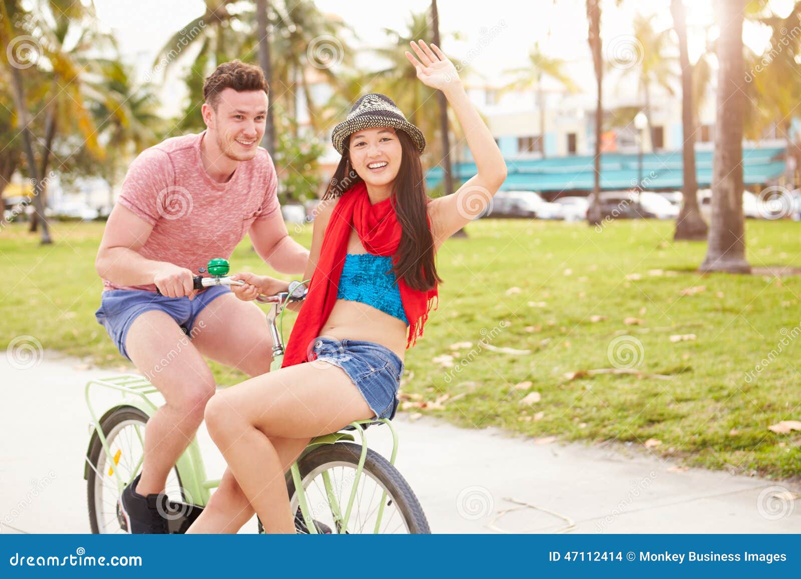 Young Couple Having Fun on Bicycle Ride Stock Photo - Image of ...