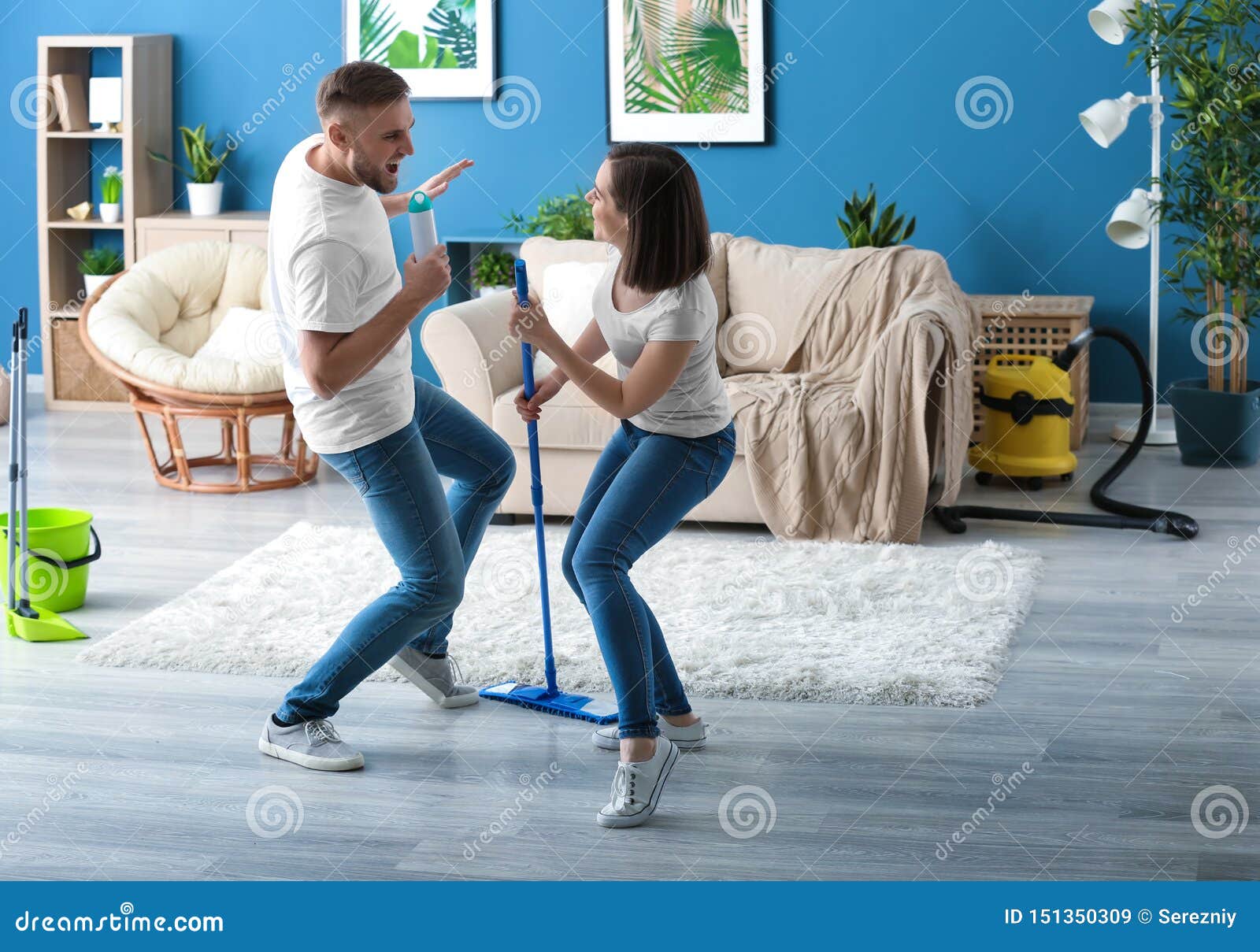 Young Couple Having Fun while Cleaning Their Flat Stock Image - Image ...
