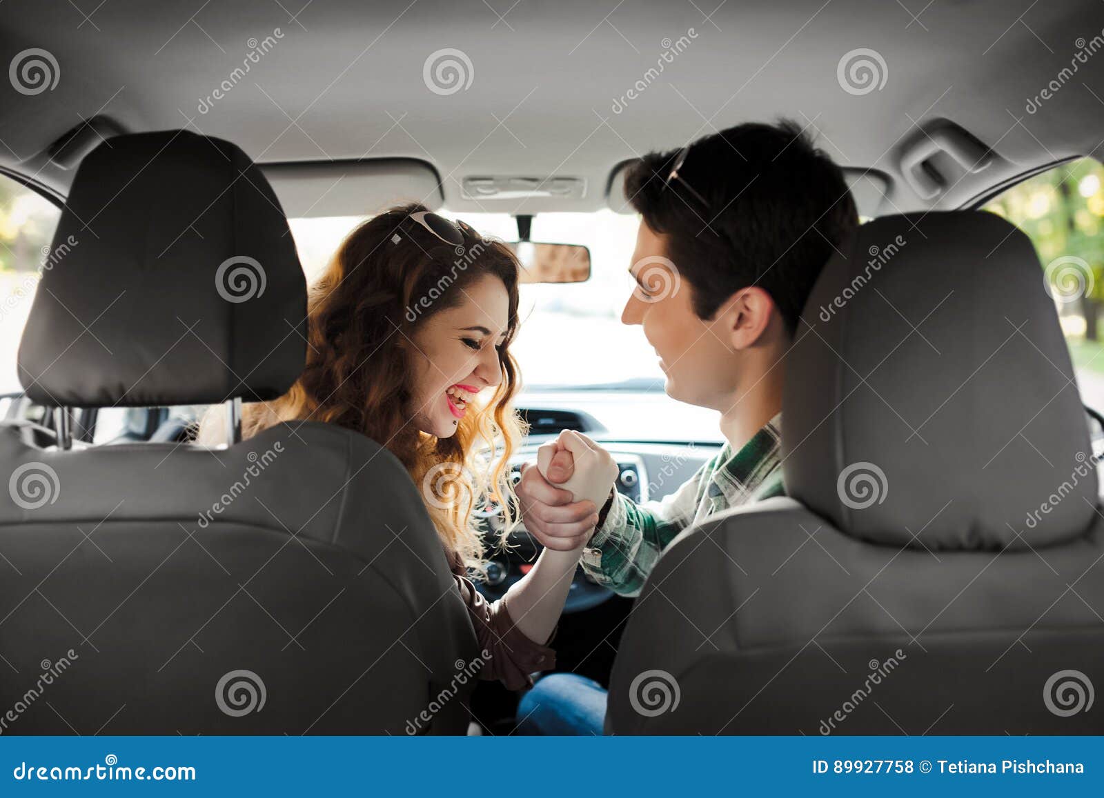 Young Couple Having Fun Inside a Car Stock Photo - Image of road, phone ...