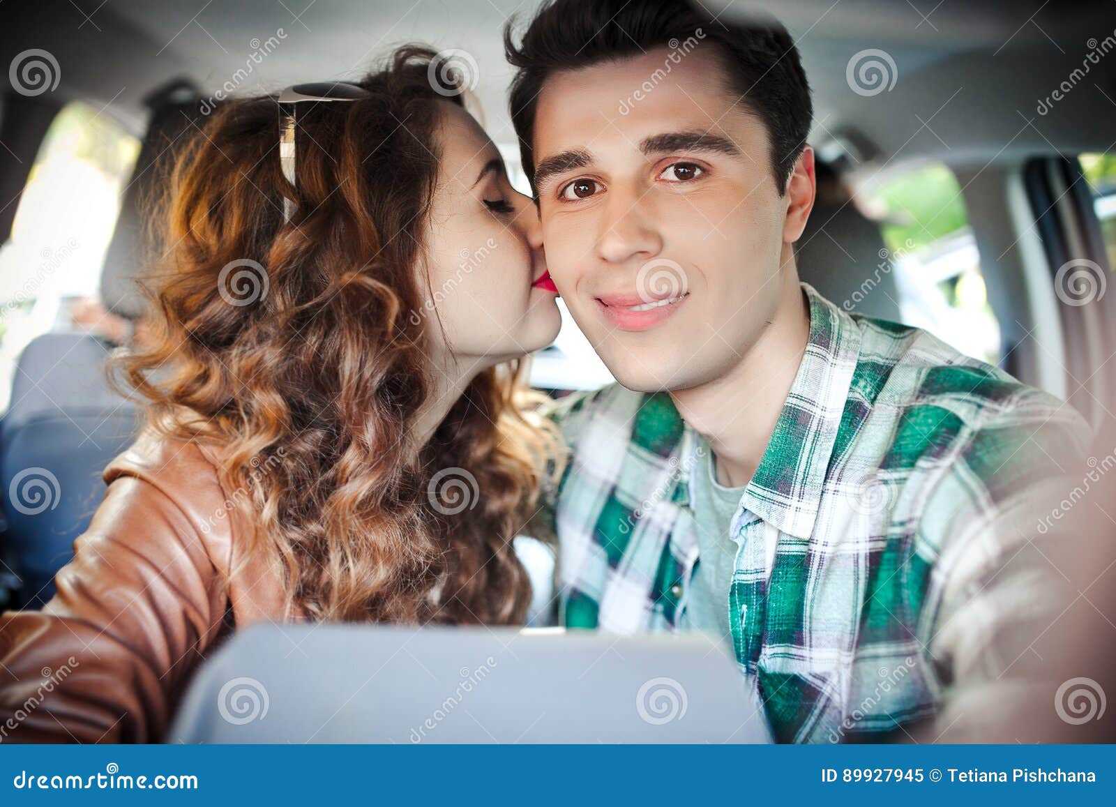 Young Couple Having Fun Inside a Car and Making Selfie Stock Image ...