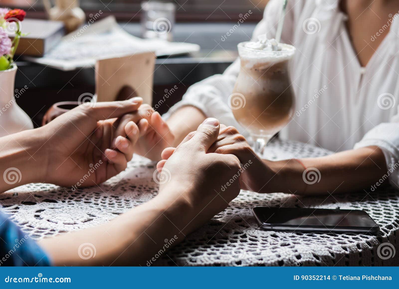 Young Couple Holding Hands at the Cafe, Closeup Stock Photo - Image of ...