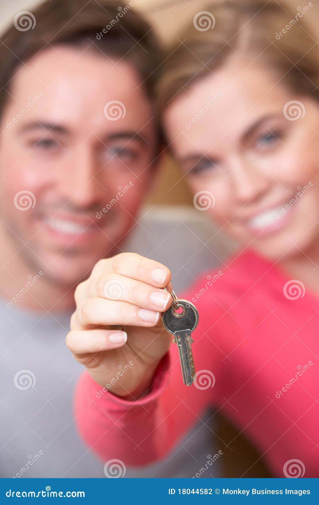 Young couple holding key stock photo. Image of relocation - 18044582