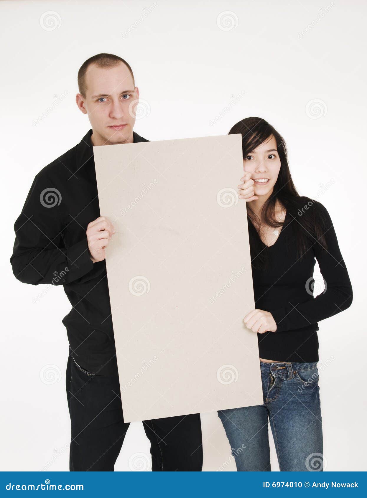 Young Couple Holding a Sign Stock Photo - Image of isolated, caucasian ...