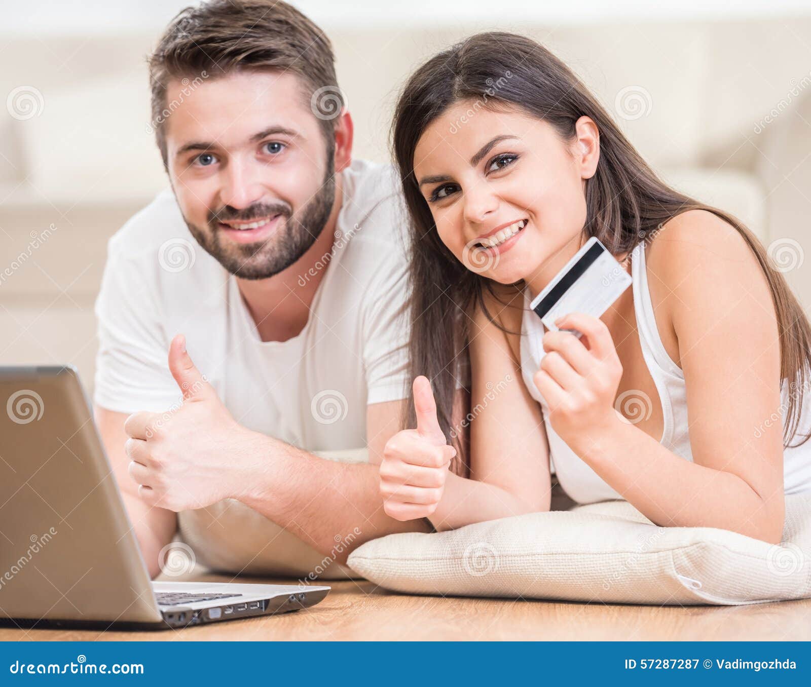 Young couple at home stock image. Image of lying, living - 57287287