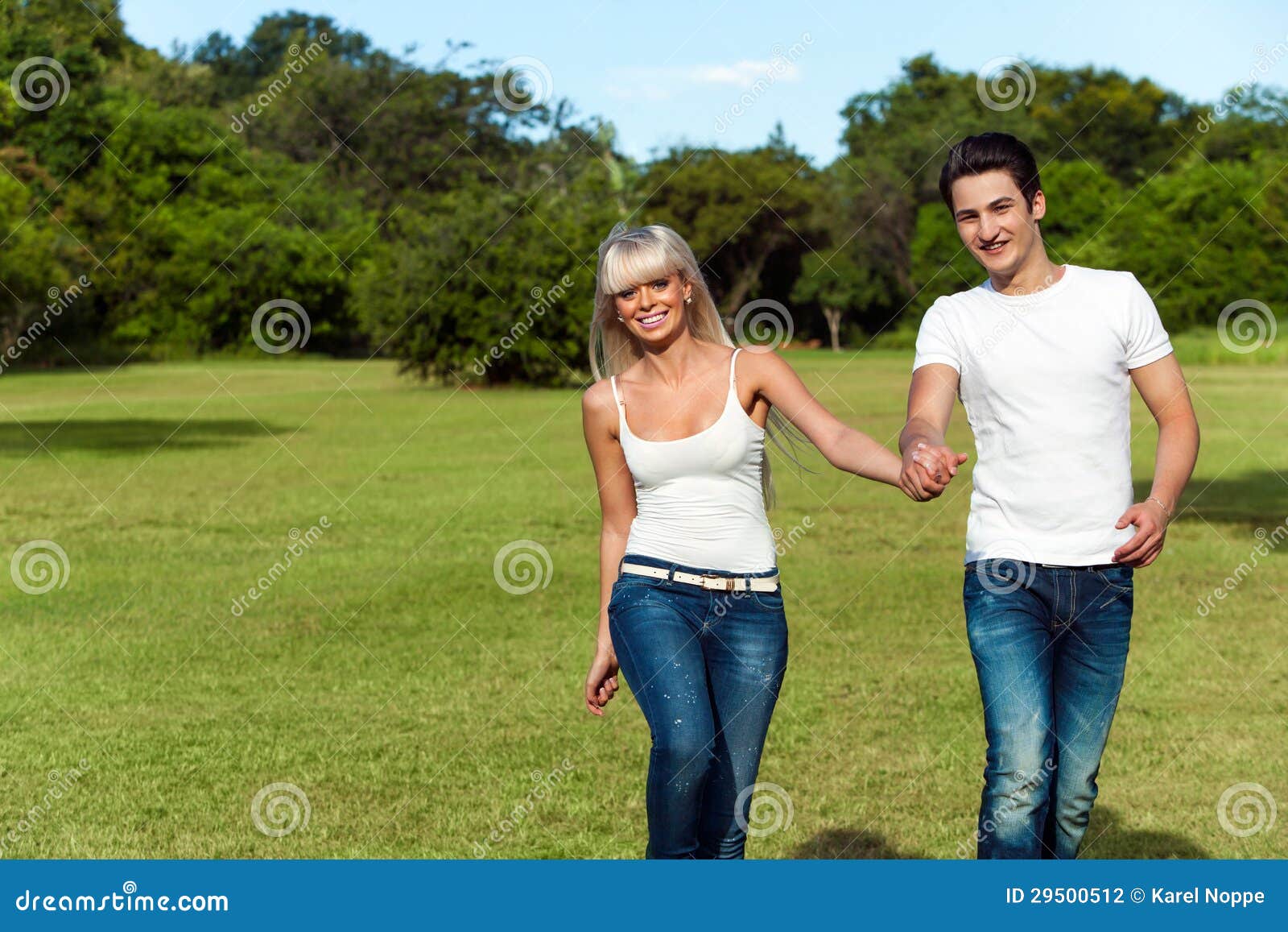 Young Couple Hopping Together in Park. Stock Photo - Image of enjoyment ...