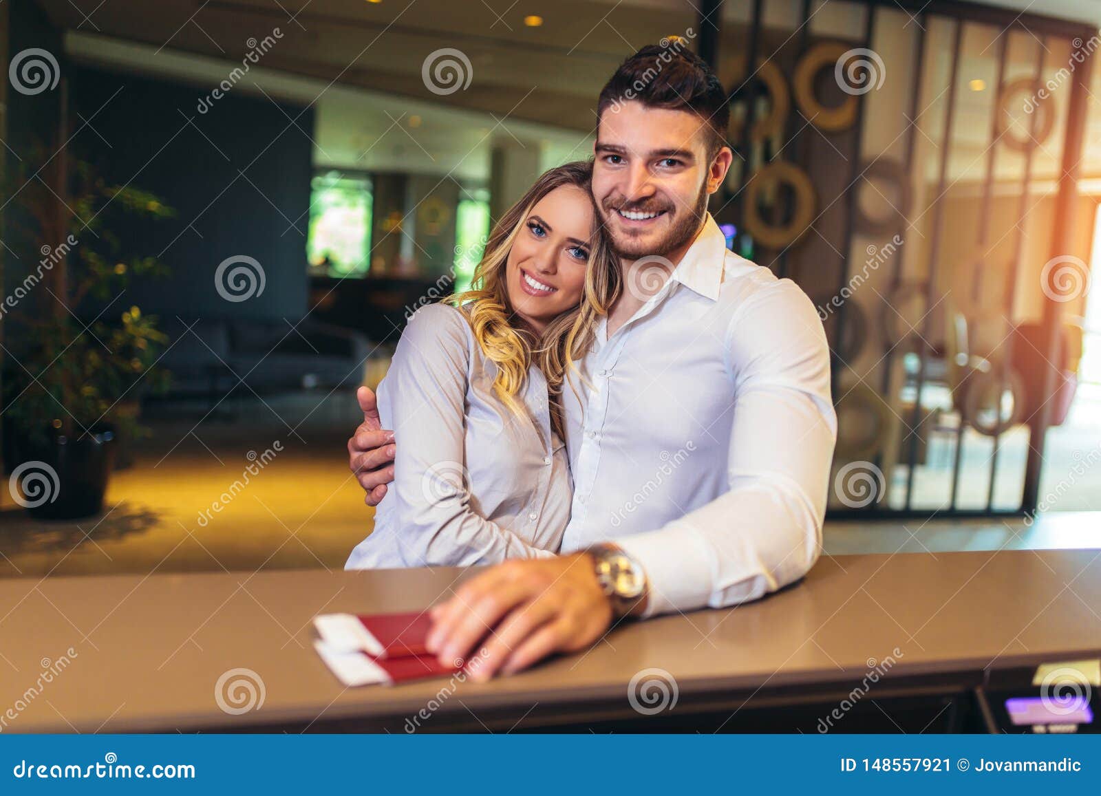 Couple at the Hotel Reception Stock Image - Image of receptionist ...