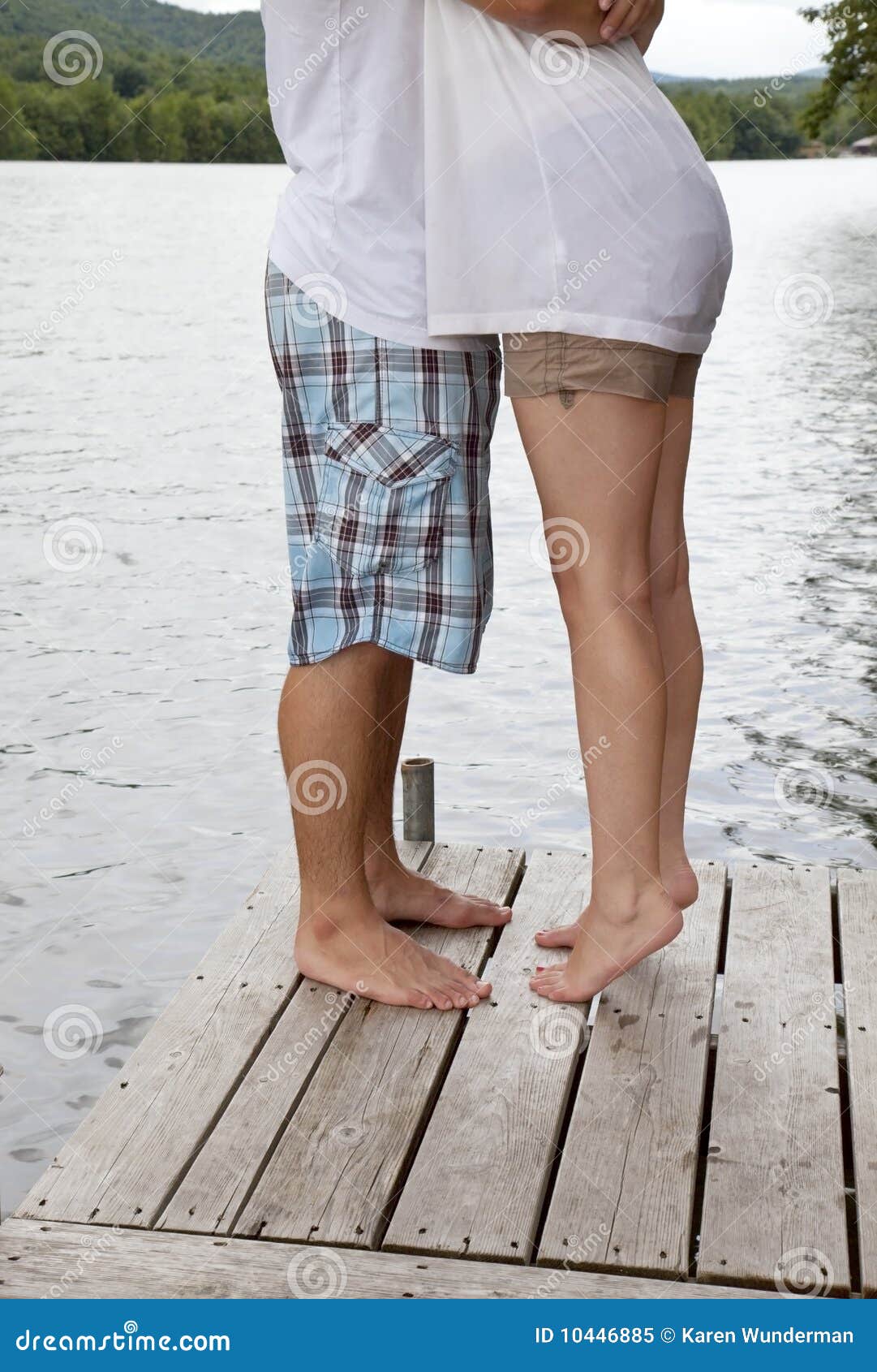 Young Couple Hugging on Dock Stock Image - Image of affection, legs ...