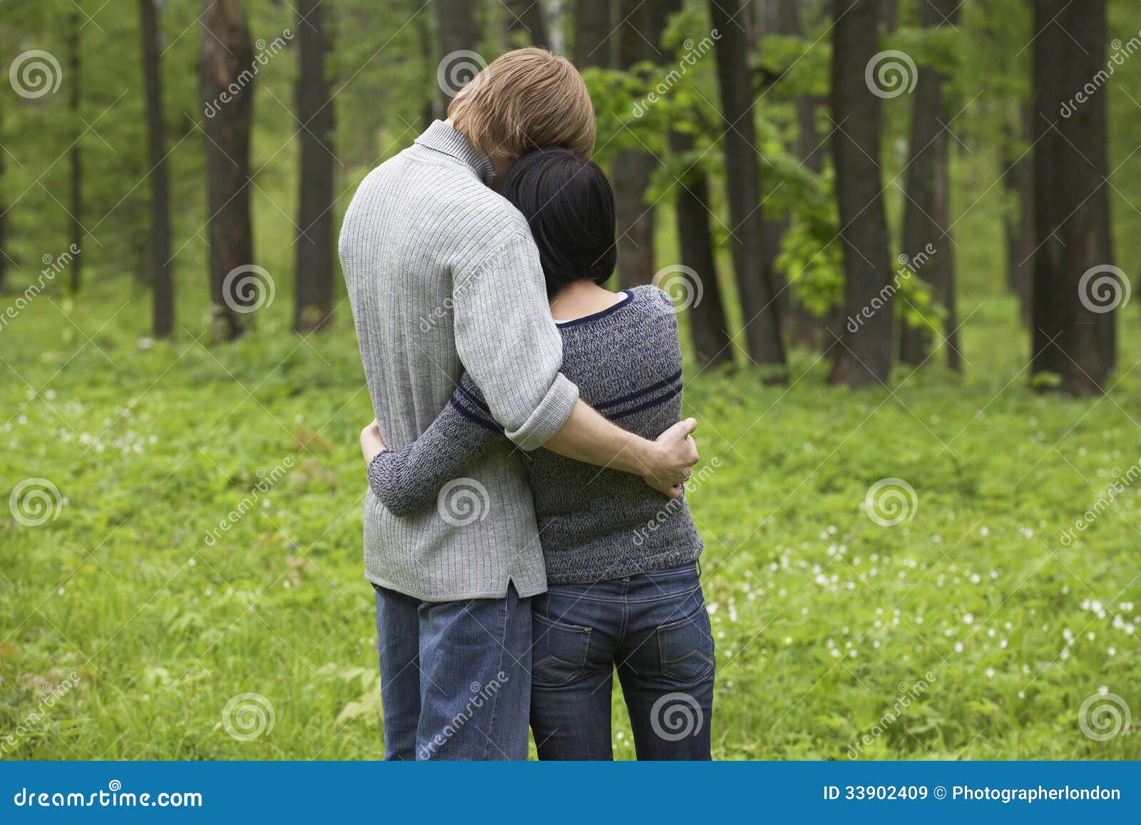 Young Couple Hugging in Forest Stock Image - Image of grassland, forest ...