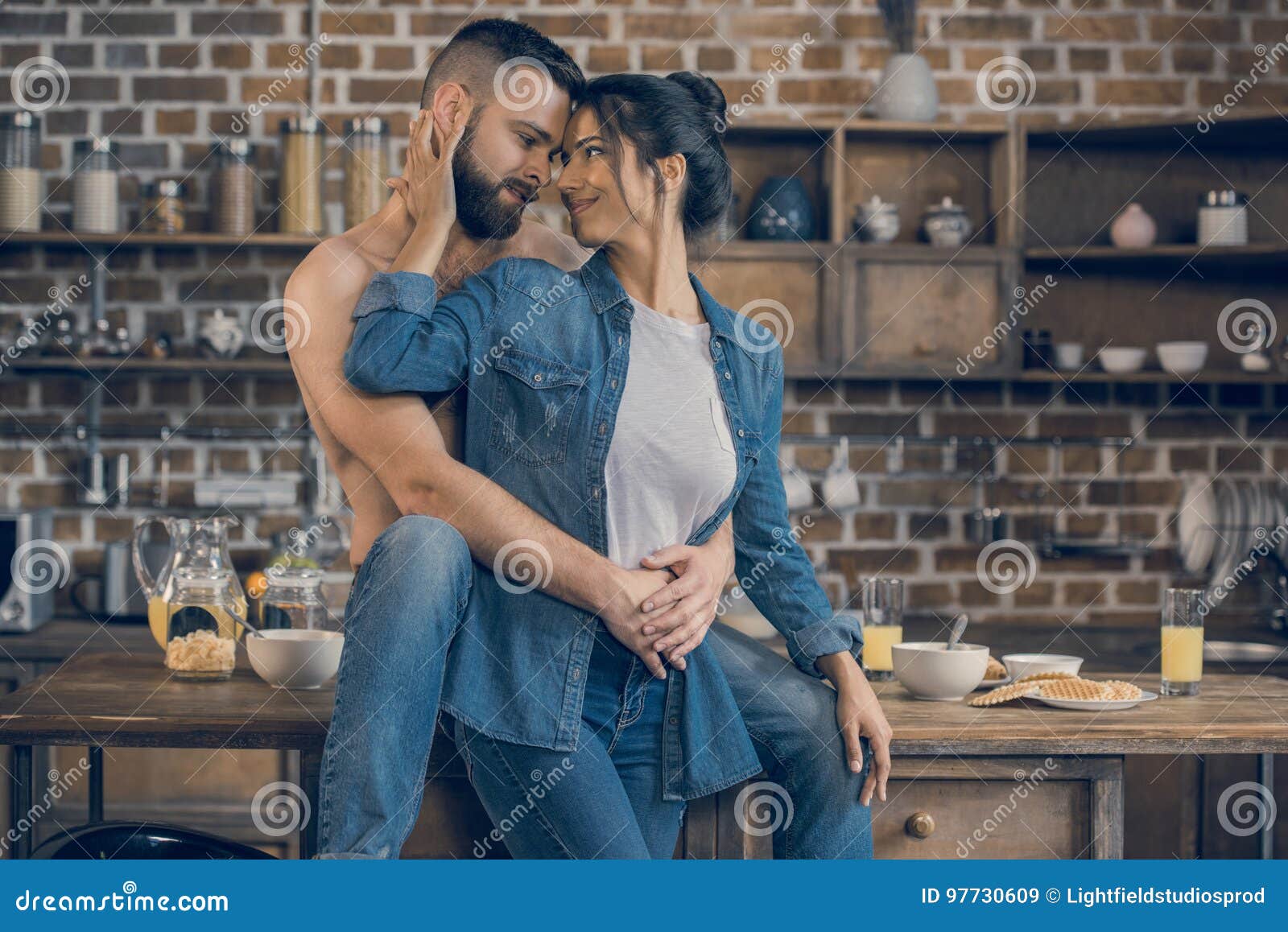 Young Couple Hugging while Having Breakfast at Home Stock Image - Image ...