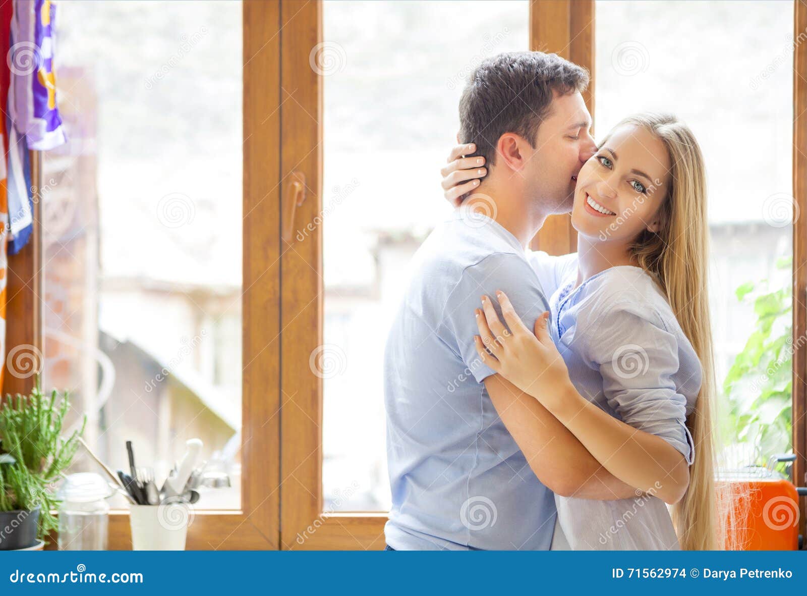 Young Couple Hugging in the Kitchen Stock Photo - Image of enjoy ...