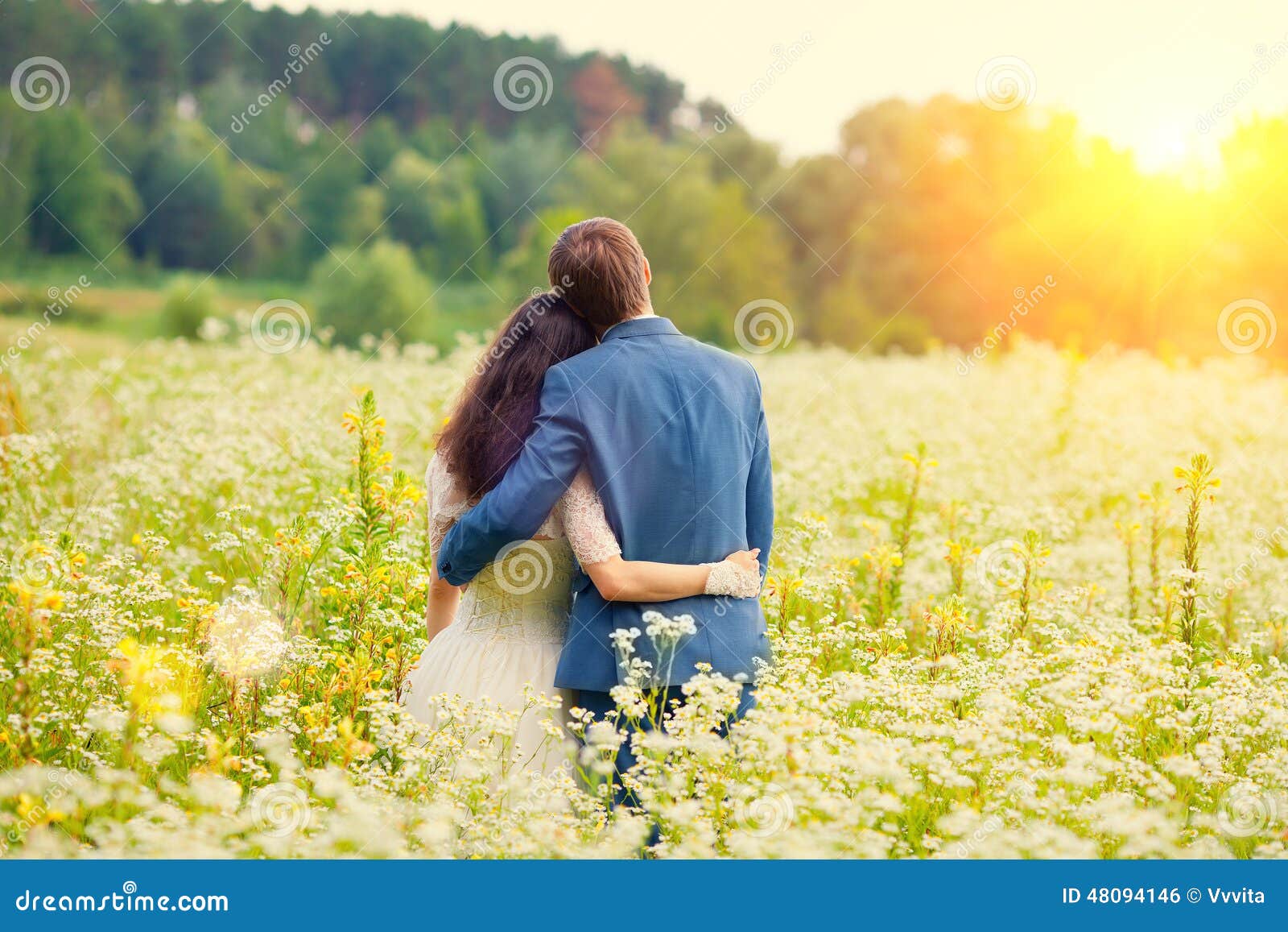 Young Couple Hugging in the Meadow Stock Photo - Image of girl, male ...