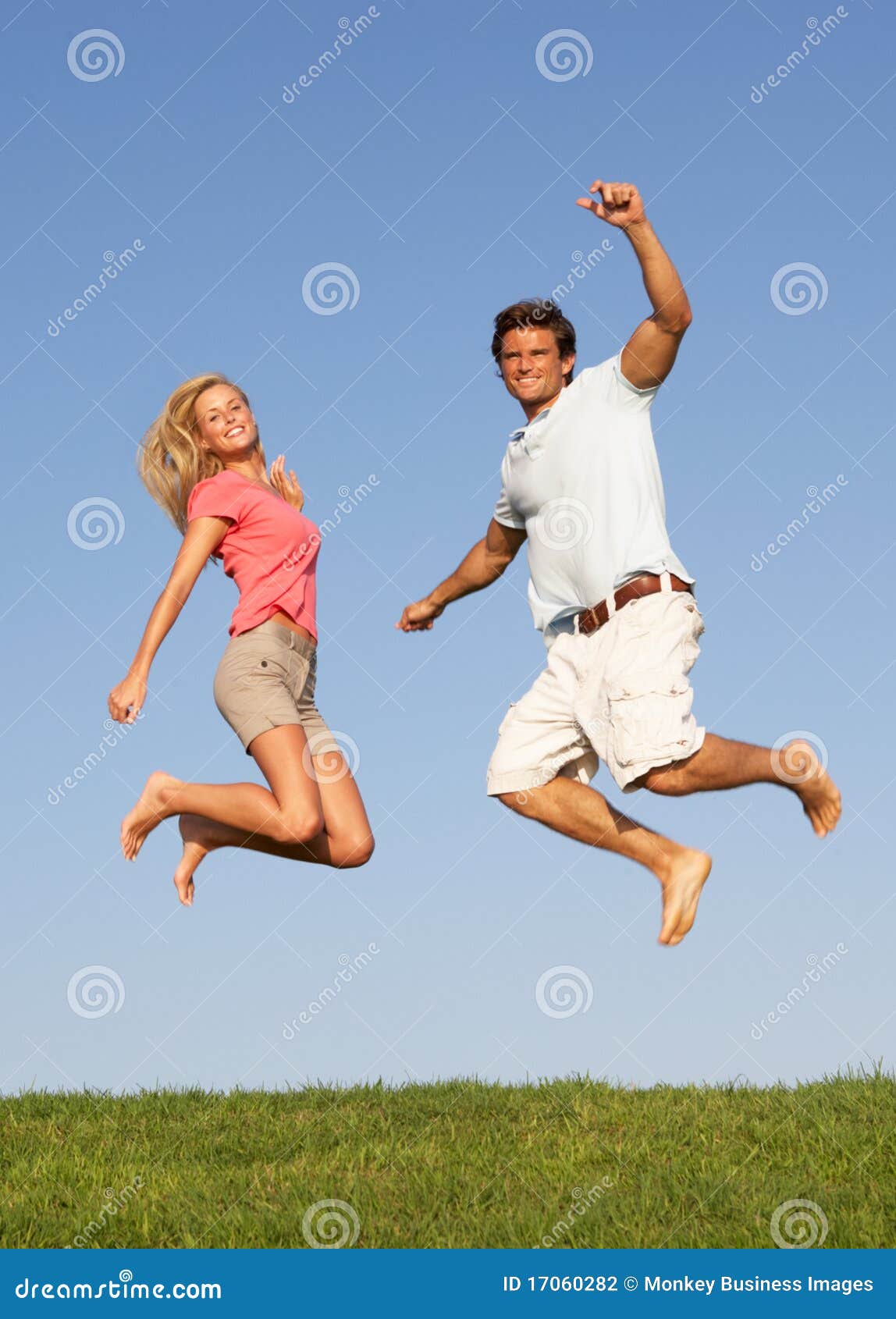Young Couple Jumping in Air Stock Photo - Image of copy, thirties: 17060282