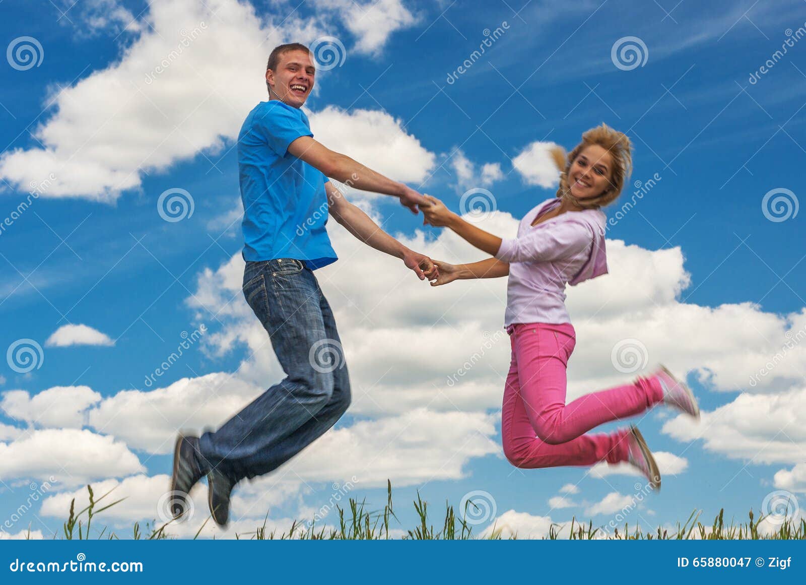 Young couple jumping stock image. Image of looking, girlfriend - 65880047