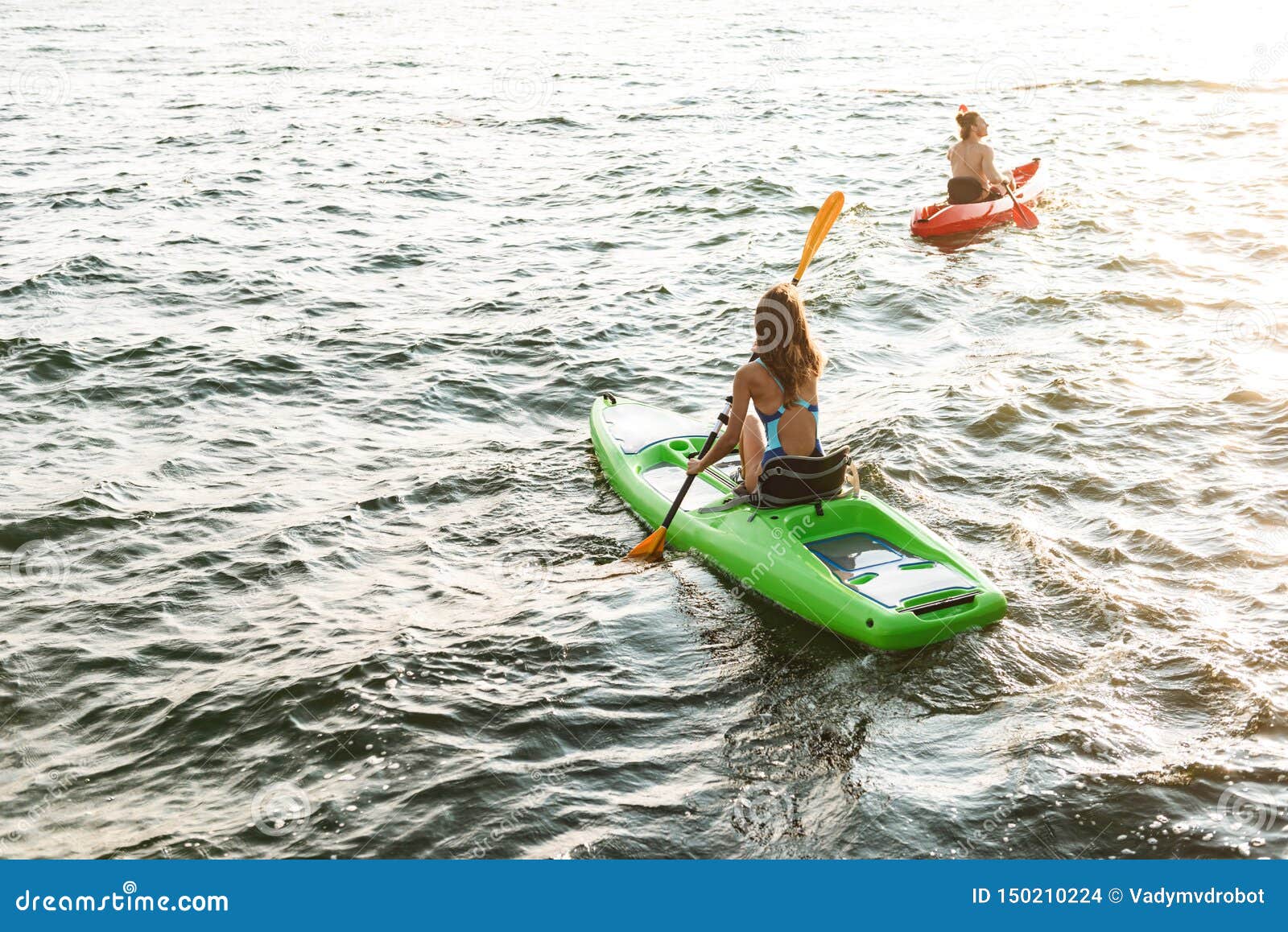Young Couple Kayaking on a Water Stock Photo - Image of beach, action ...