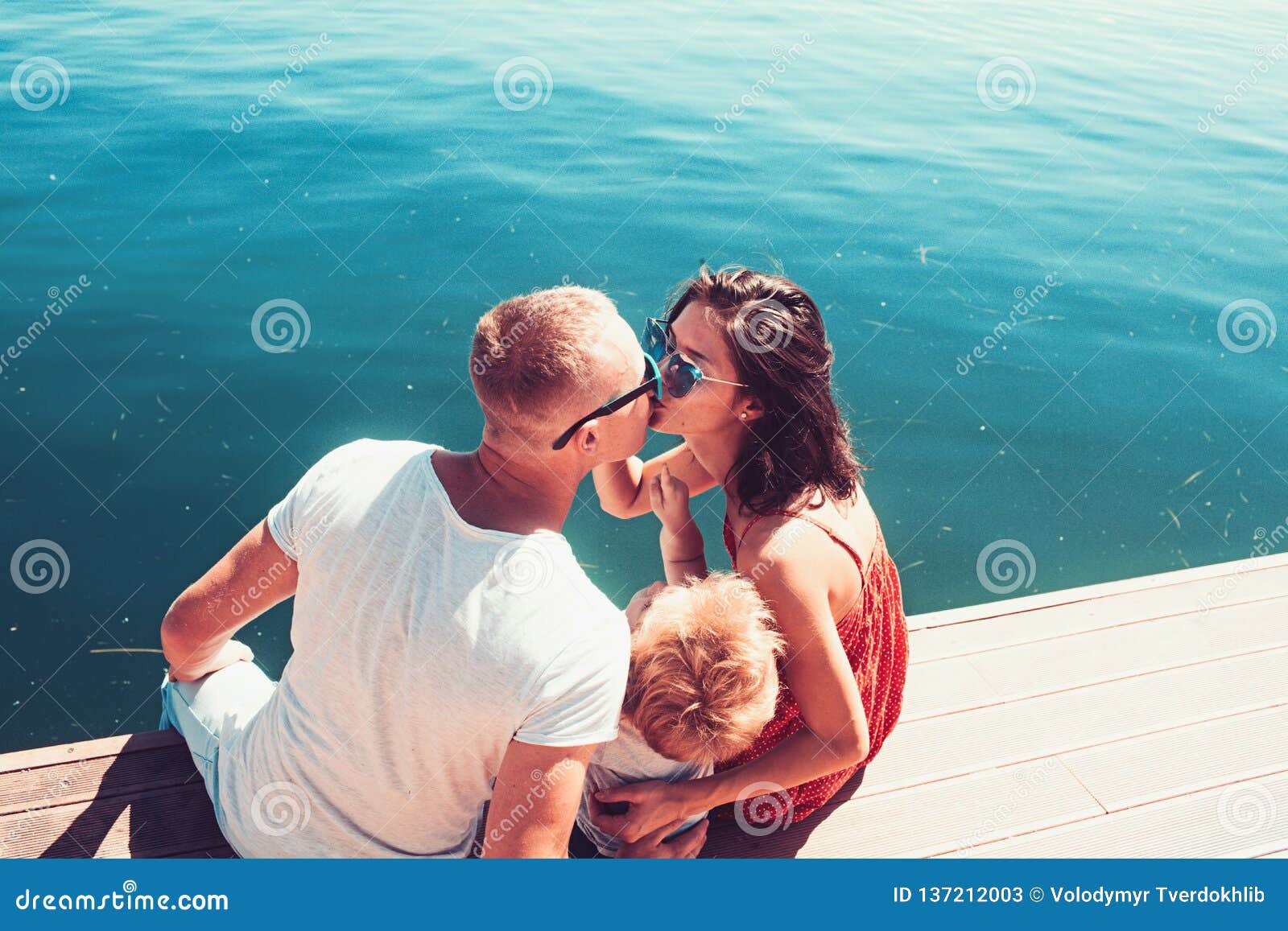 Young Couple Kiss Each Other on the Beach. Stock Image - Image of ...