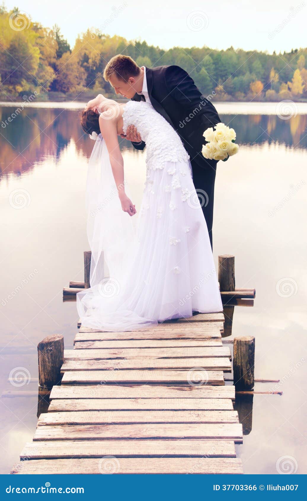 Young Couple Kissing on the Bridge Stock Photo - Image of lady, cute ...