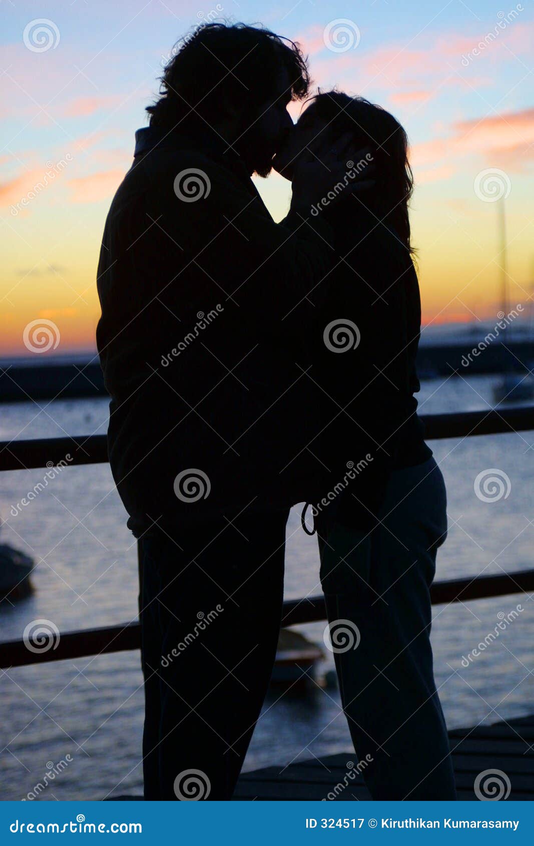 A Young Couple Kissing at Sunset Stock Image - Image of caress, dawn ...
