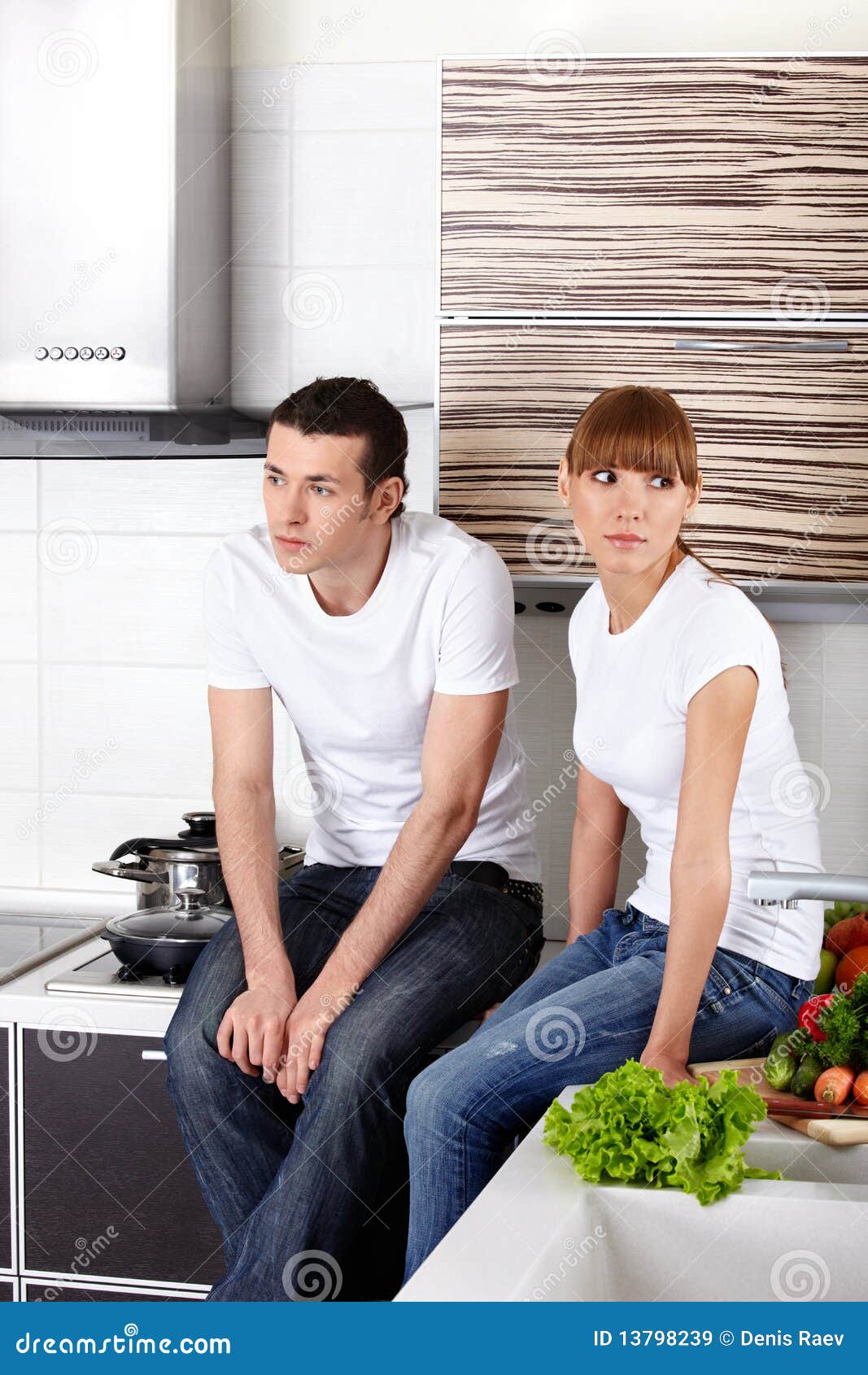 Young couple at kitchen stock image. Image of expressing - 13798239