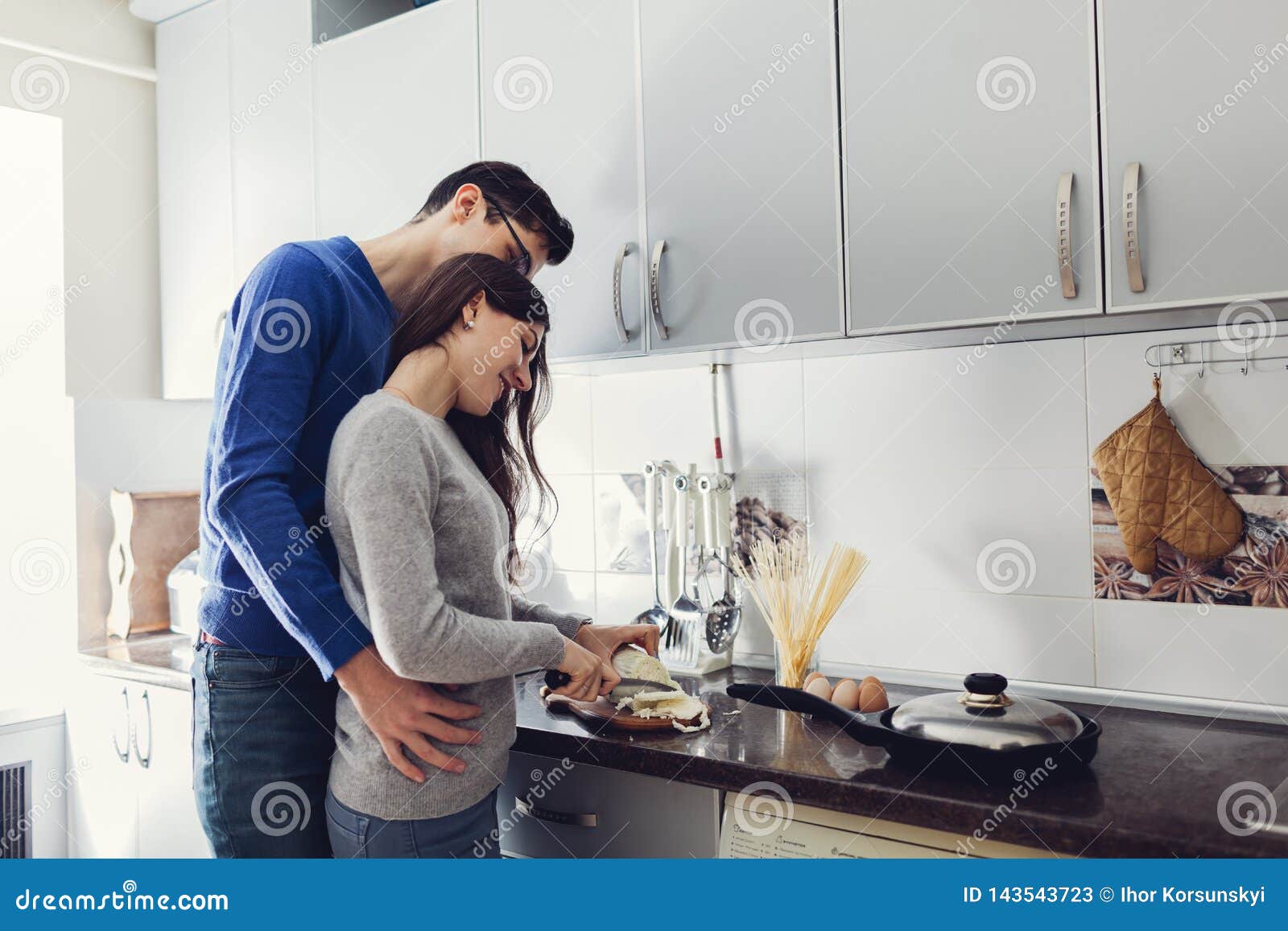 Young Couple on Kitchen Hugging and Cooking Dinner. Stock Image - Image ...