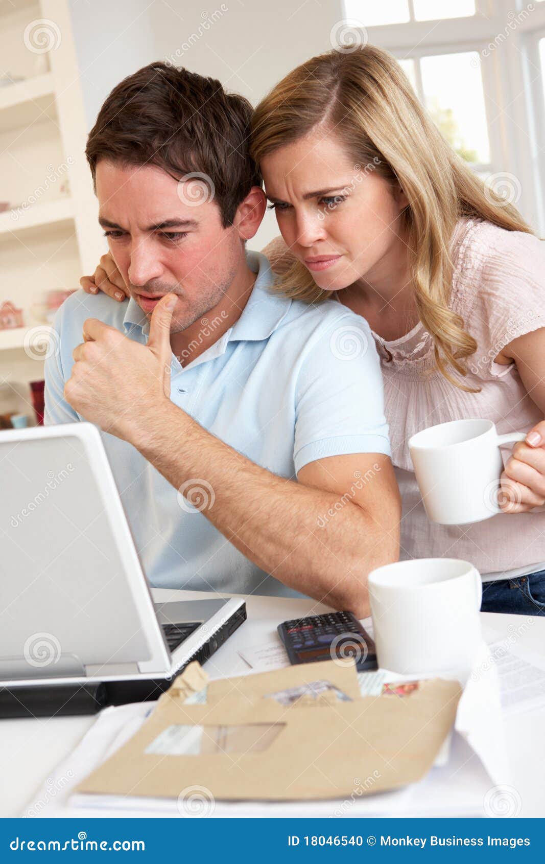 Young Couple at a Laptop Computer Stock Photo - Image of puzzled ...