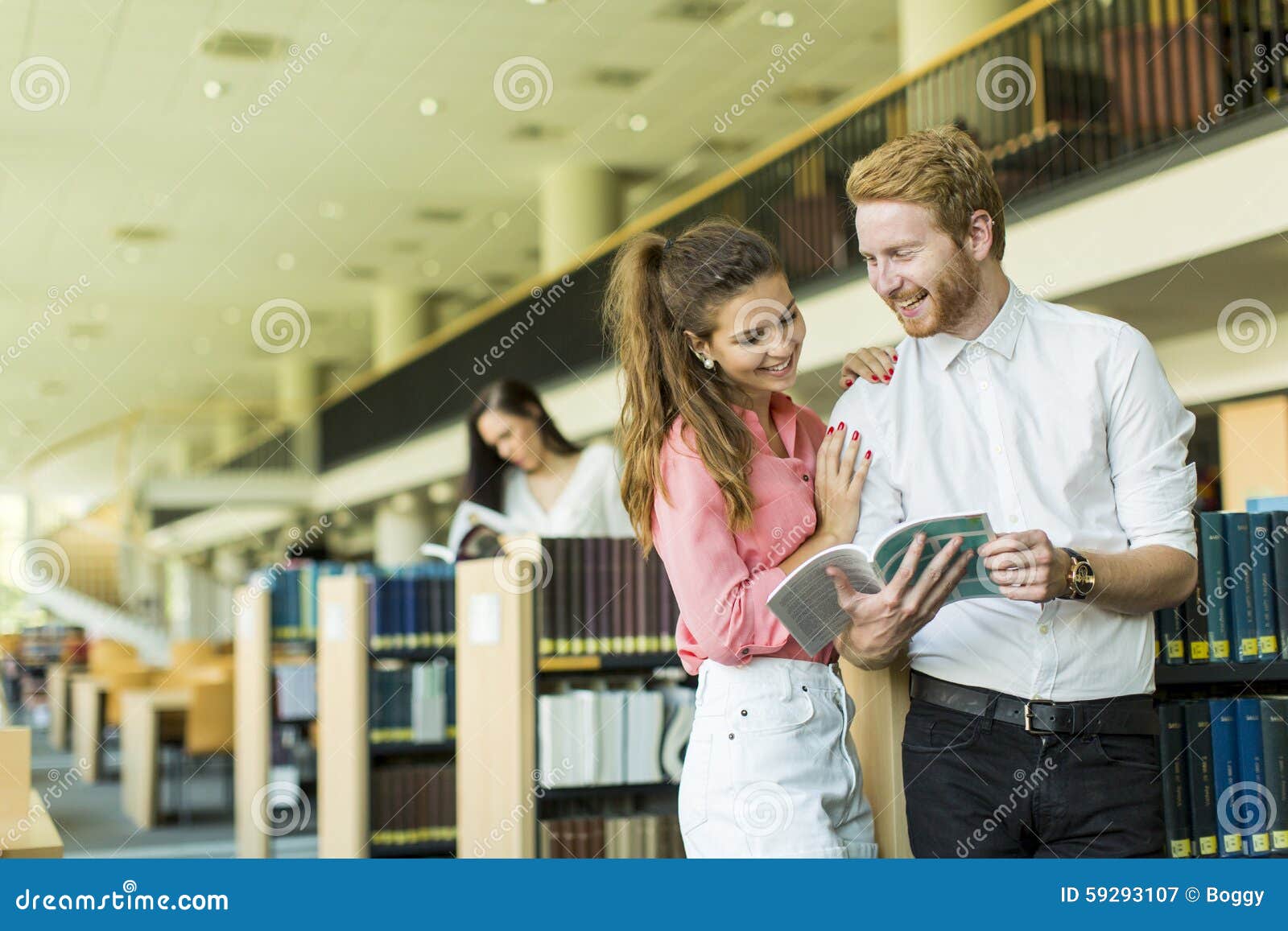 Young Couple in the Library Stock Image - Image of indoor, books: 59293107